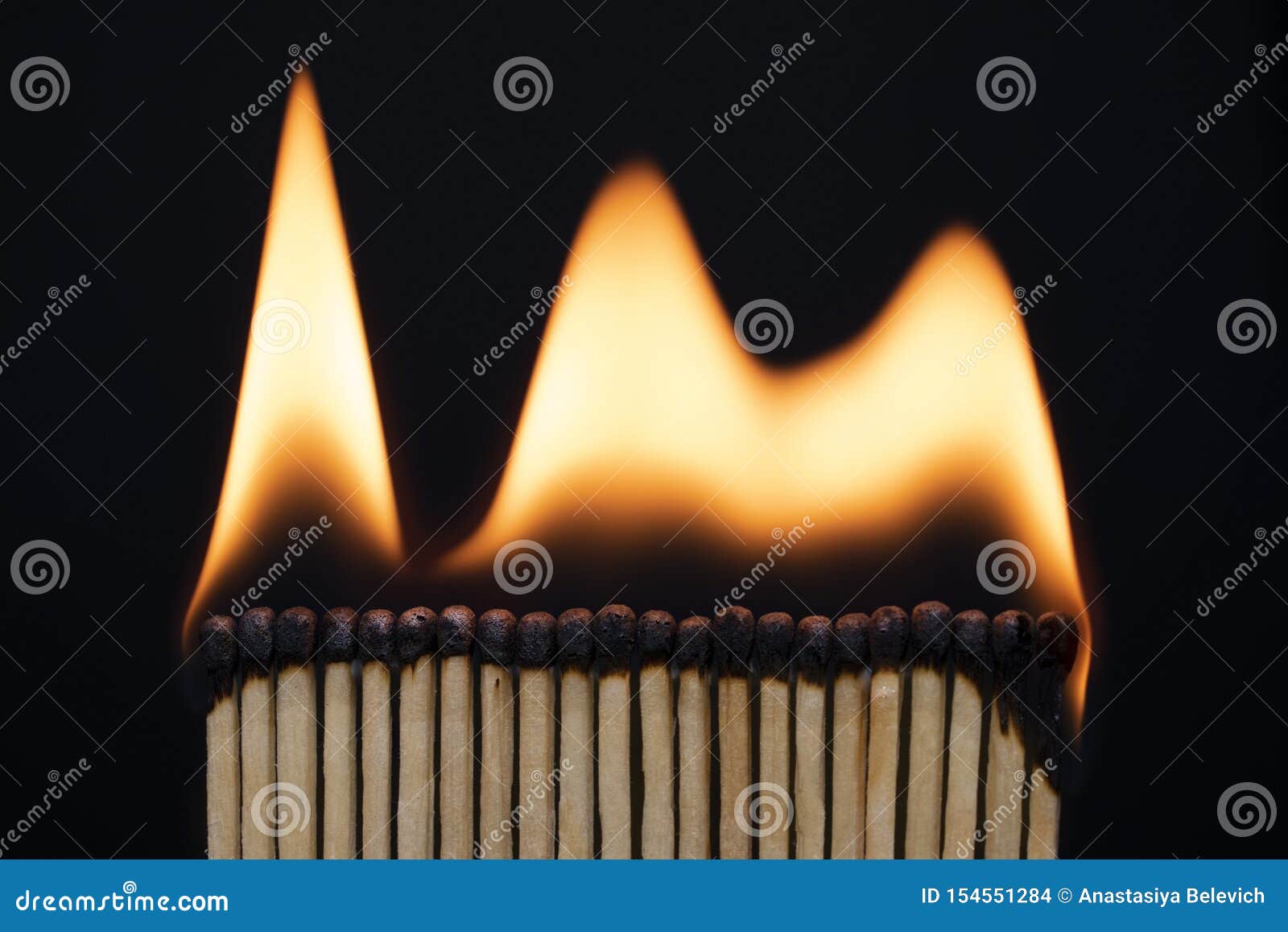 A Row of Burning Matches on a Black Background. the Flame Moves from ...