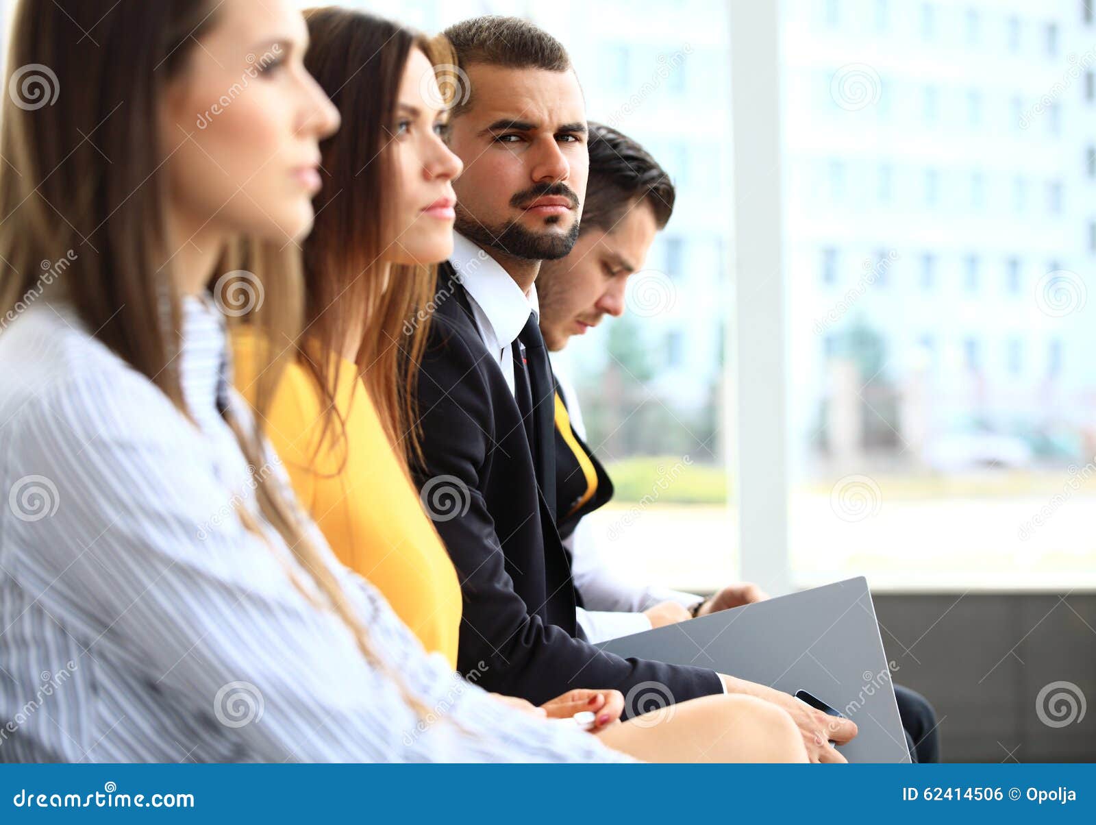 Row of Business People Making Notes at Seminar Stock Photo - Image of ...