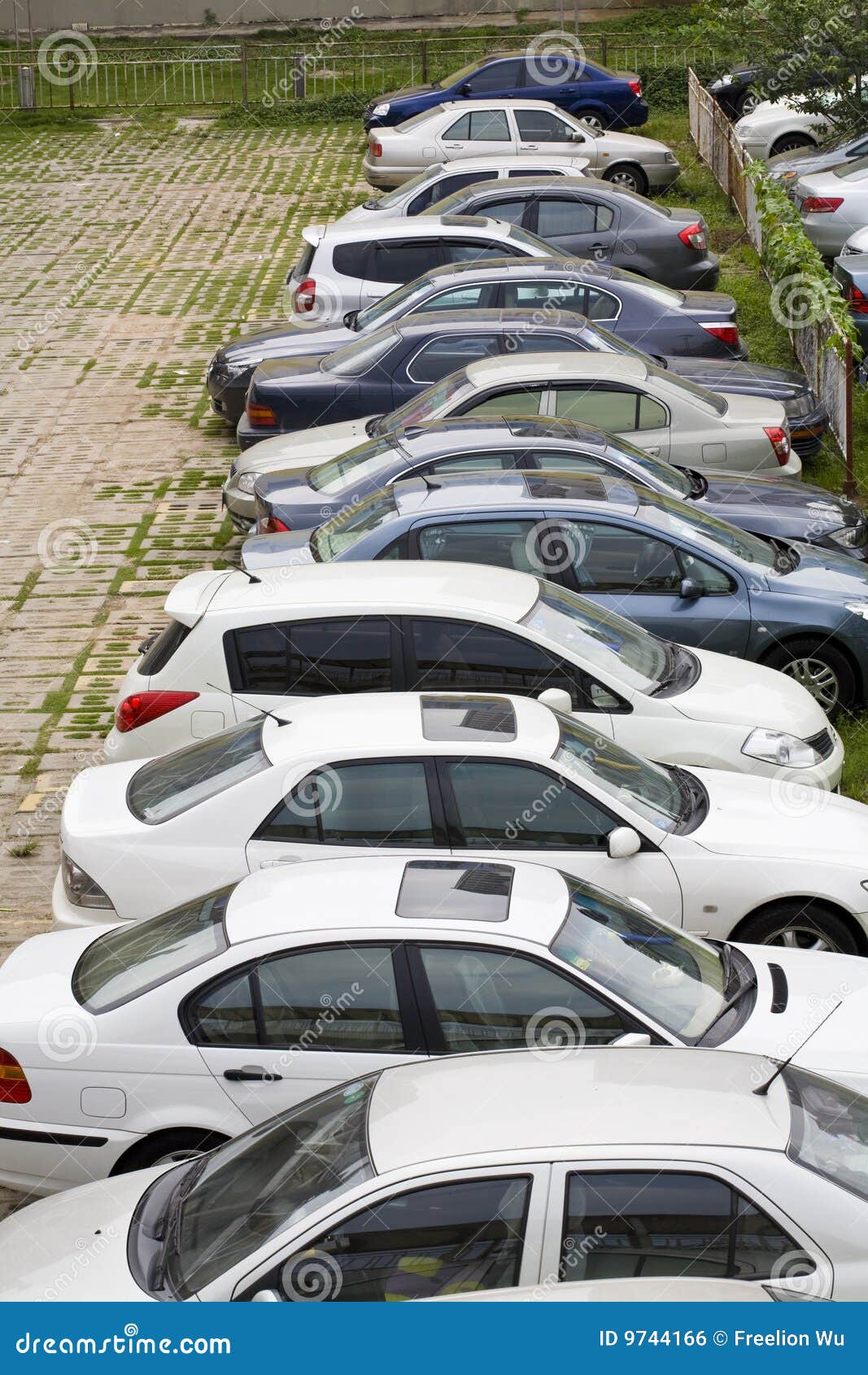 Row of cars on parking lot stock photo. Image of large - 9744166