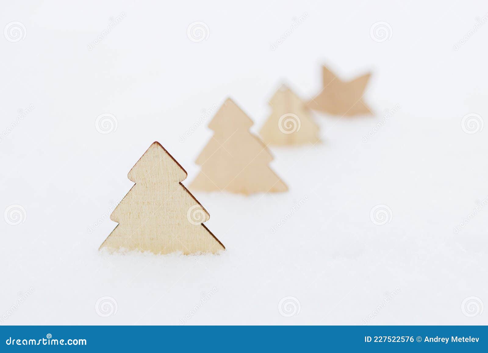 A Row of Carved Decorative Toys Inserted into the Snow Stock Photo ...