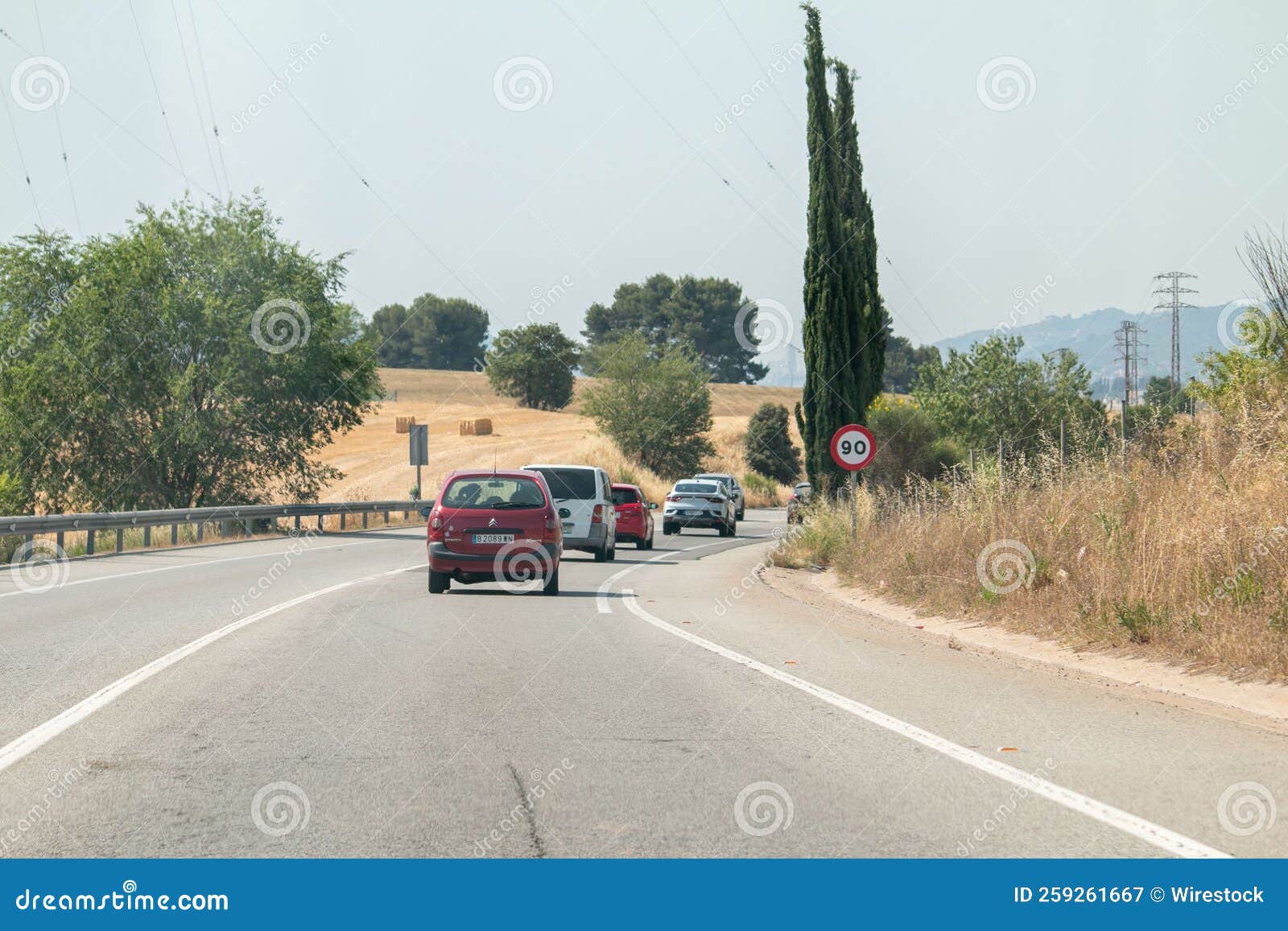 Row of Ccars Driving Down a Highway Under the Bright Sunlight Editorial ...