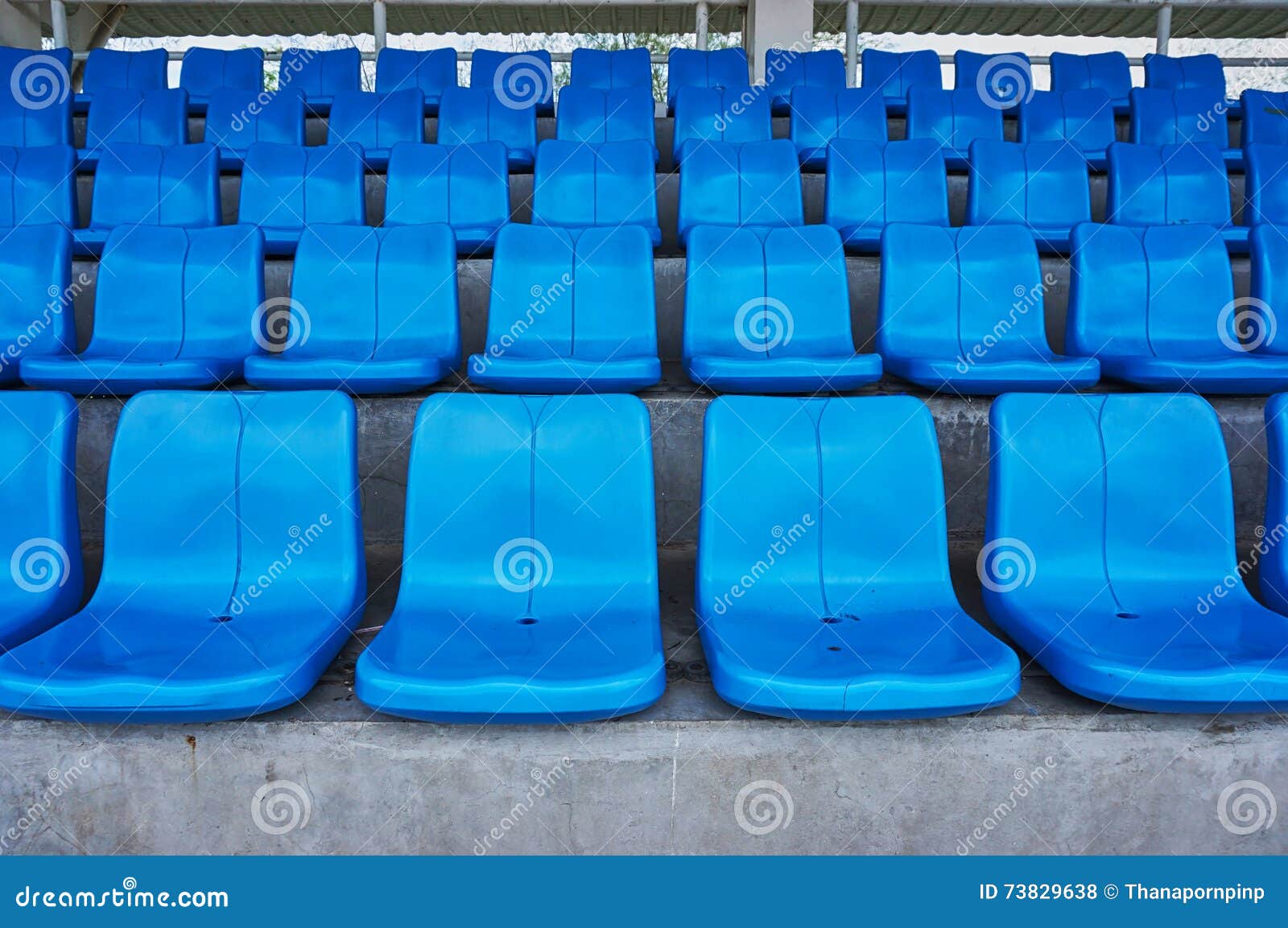 Row of chairs in arena. stock photo. Image of plastic - 73829638