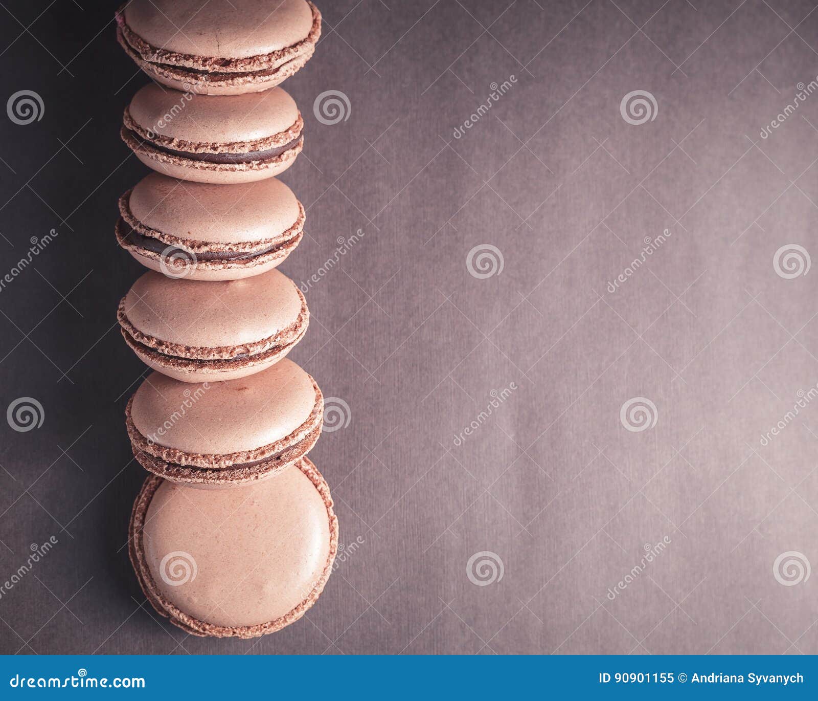 Row of Chocolate Pastel Brown Macarons or Macaroons Stock Image - Image ...