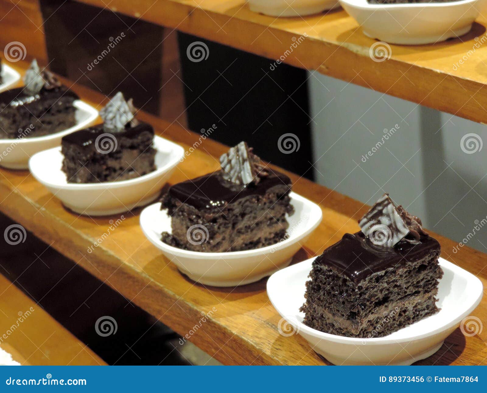 Row of chocolate pastries stock photo. Image of chocolate - 89373456
