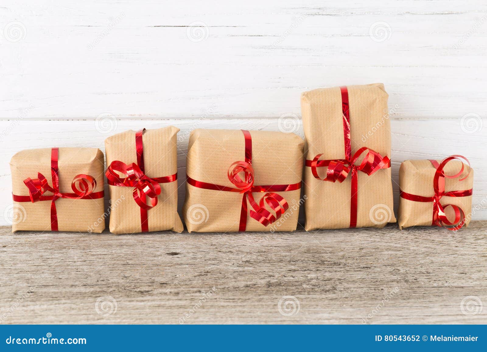 Row of Christmas Presents on a Table Stock Photo - Image of homemade ...