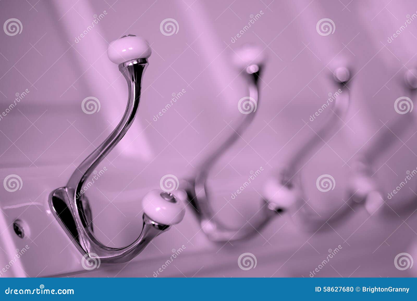 Row of coat hooks stock photo. Image of closeup, organization - 58627680