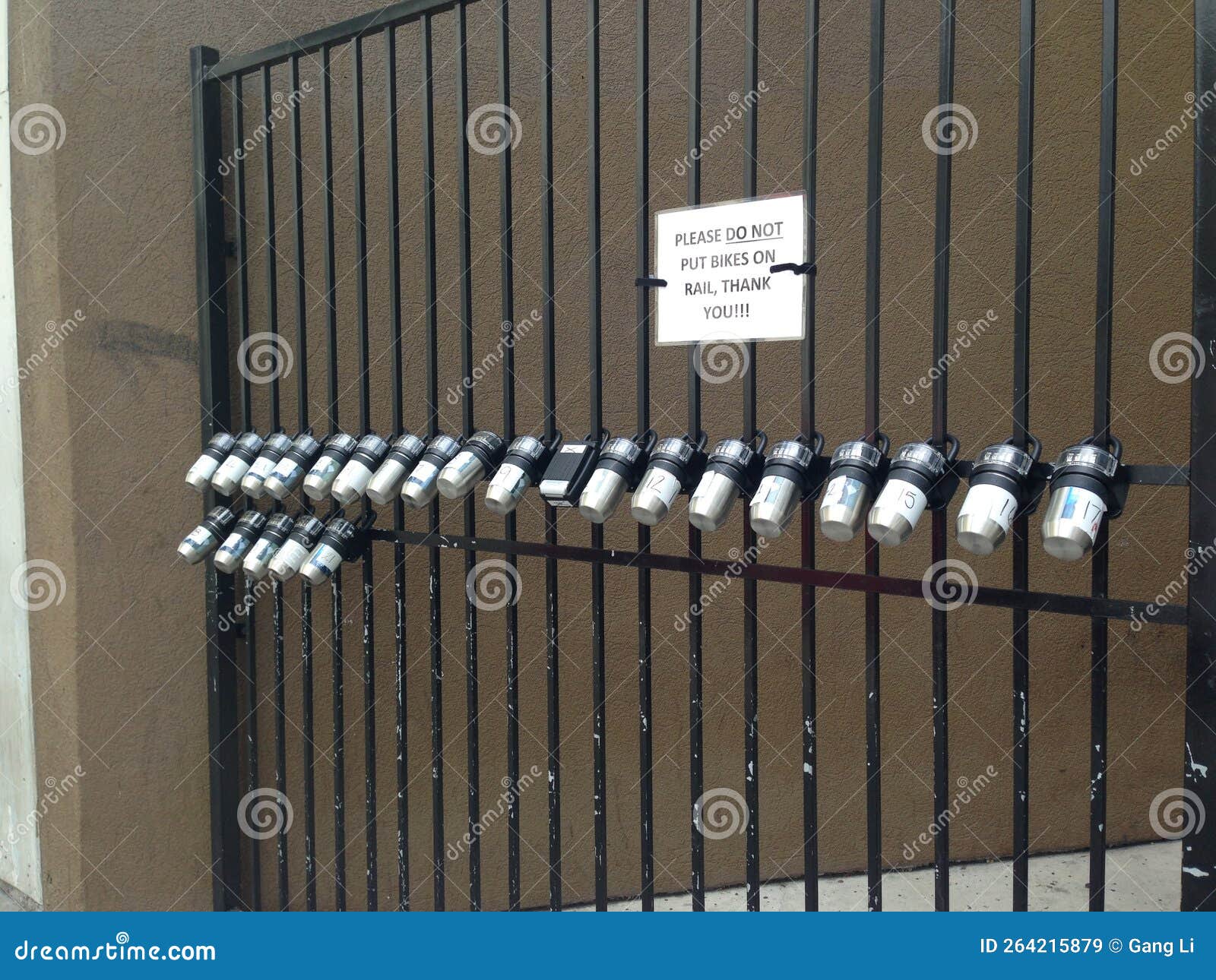 A Row of Key Boxes on an Iron Fence Stock Image - Image of boxes ...