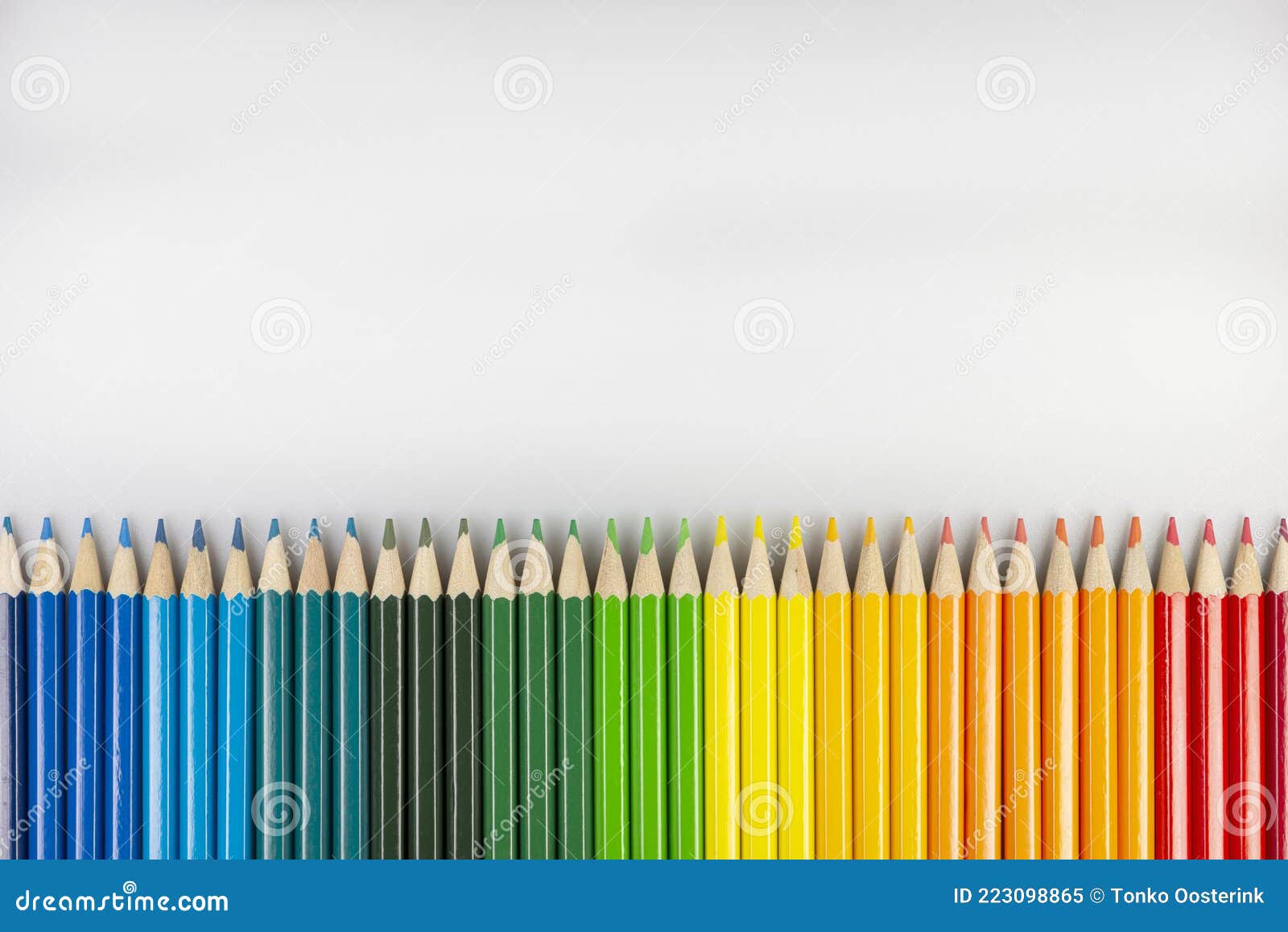 Row of Colored Pencils on a White Sheet of Paper Stock Image - Image of ...