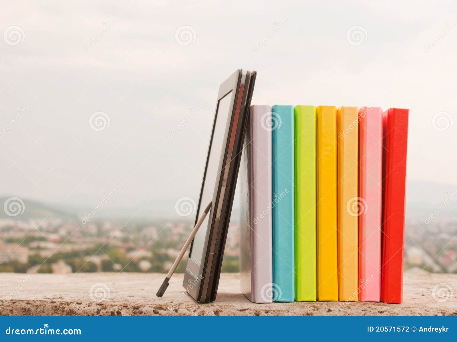 Row of Colorful Books with Electronic Book Reader Stock Photo - Image ...
