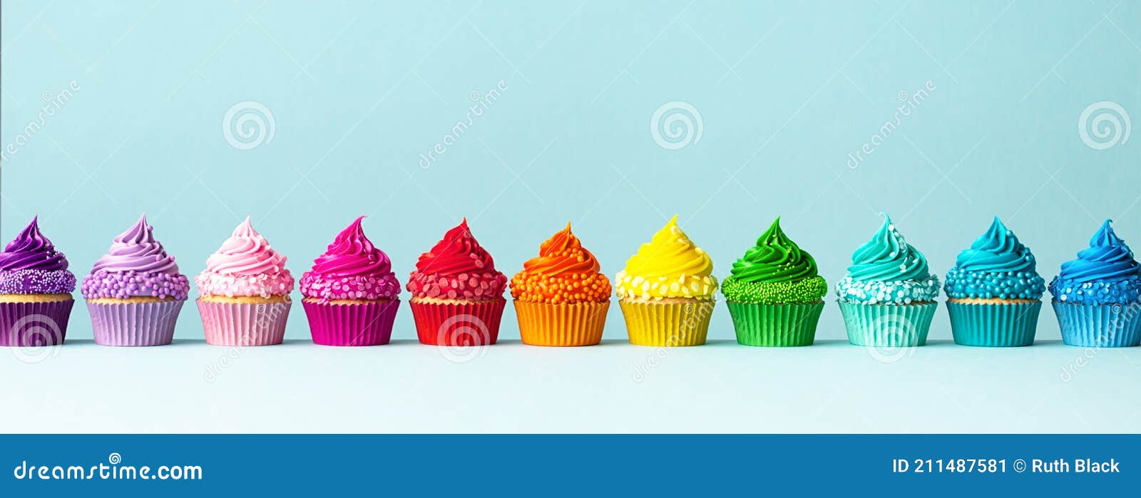 Row of colorful cupcakes stock image. Image of cakes - 211487581
