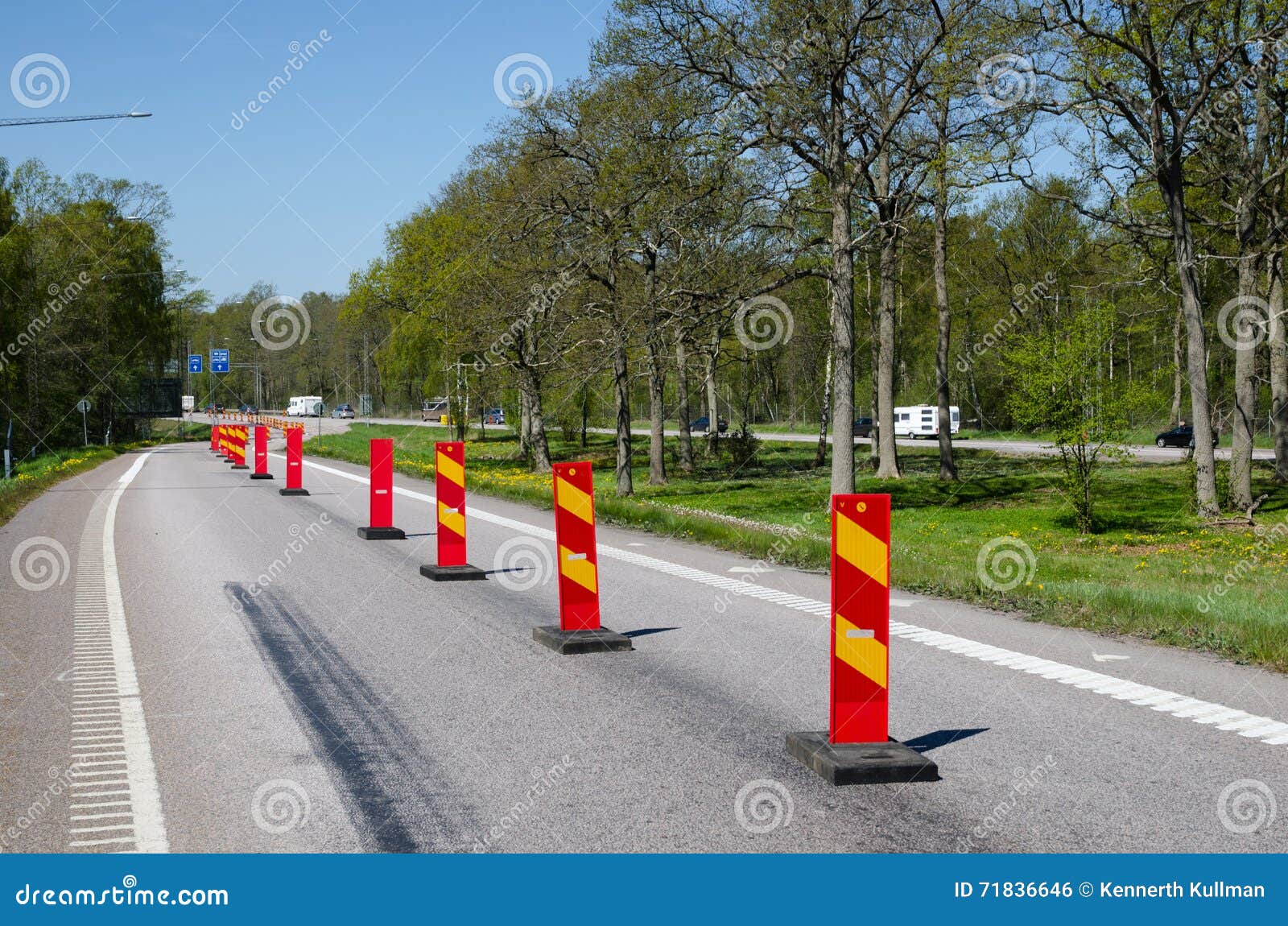 Row of colorful roadblocks stock photo. Image of caution - 71836646