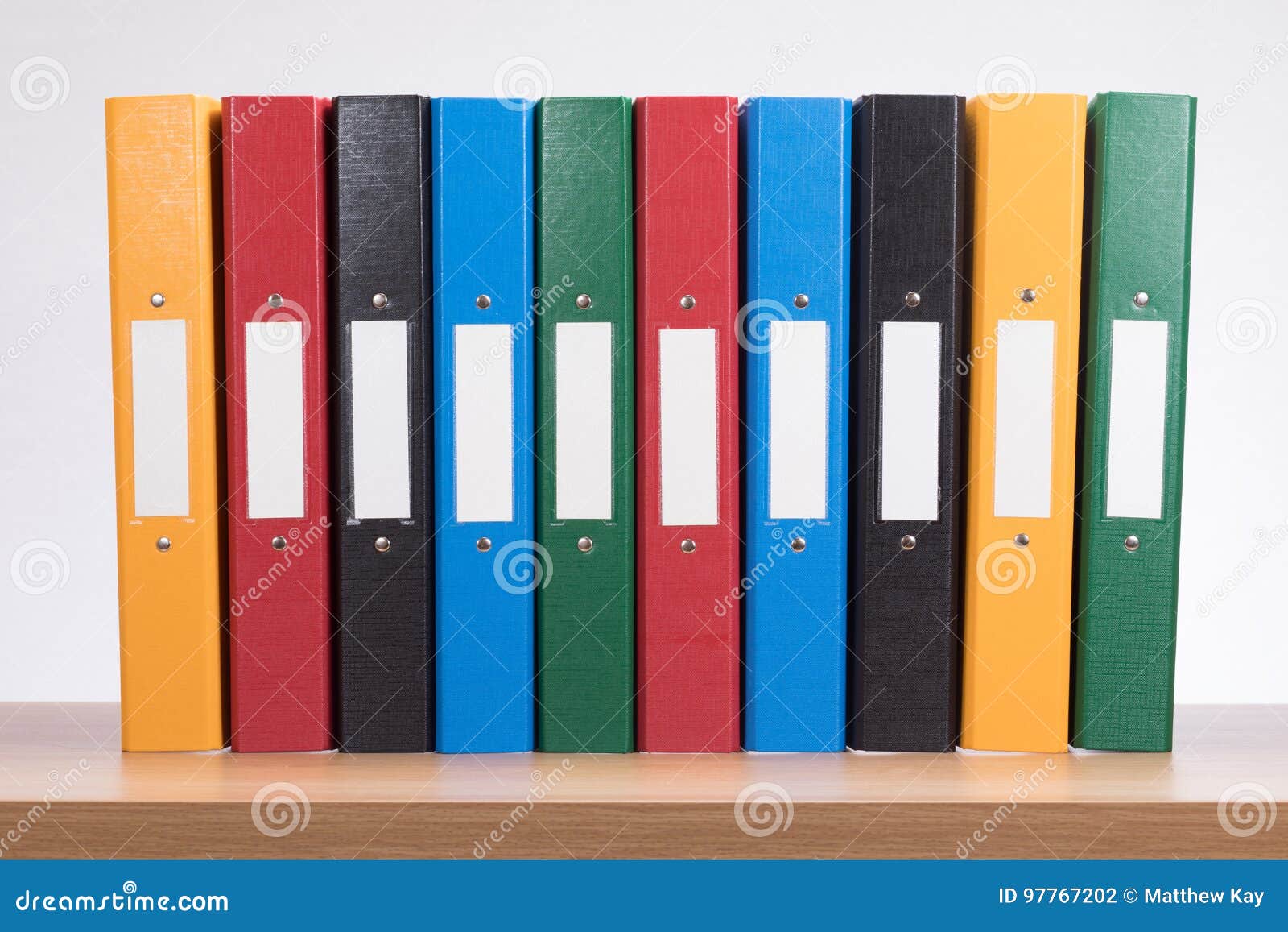Row of Coloured Office Document Folders on Shelf Stock Photo - Image of ...