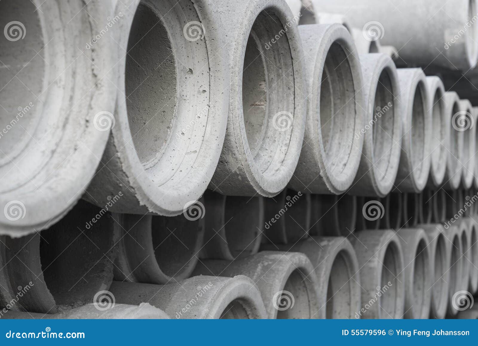 Row of concrete pipes stock photo. Image of perspective - 55579596