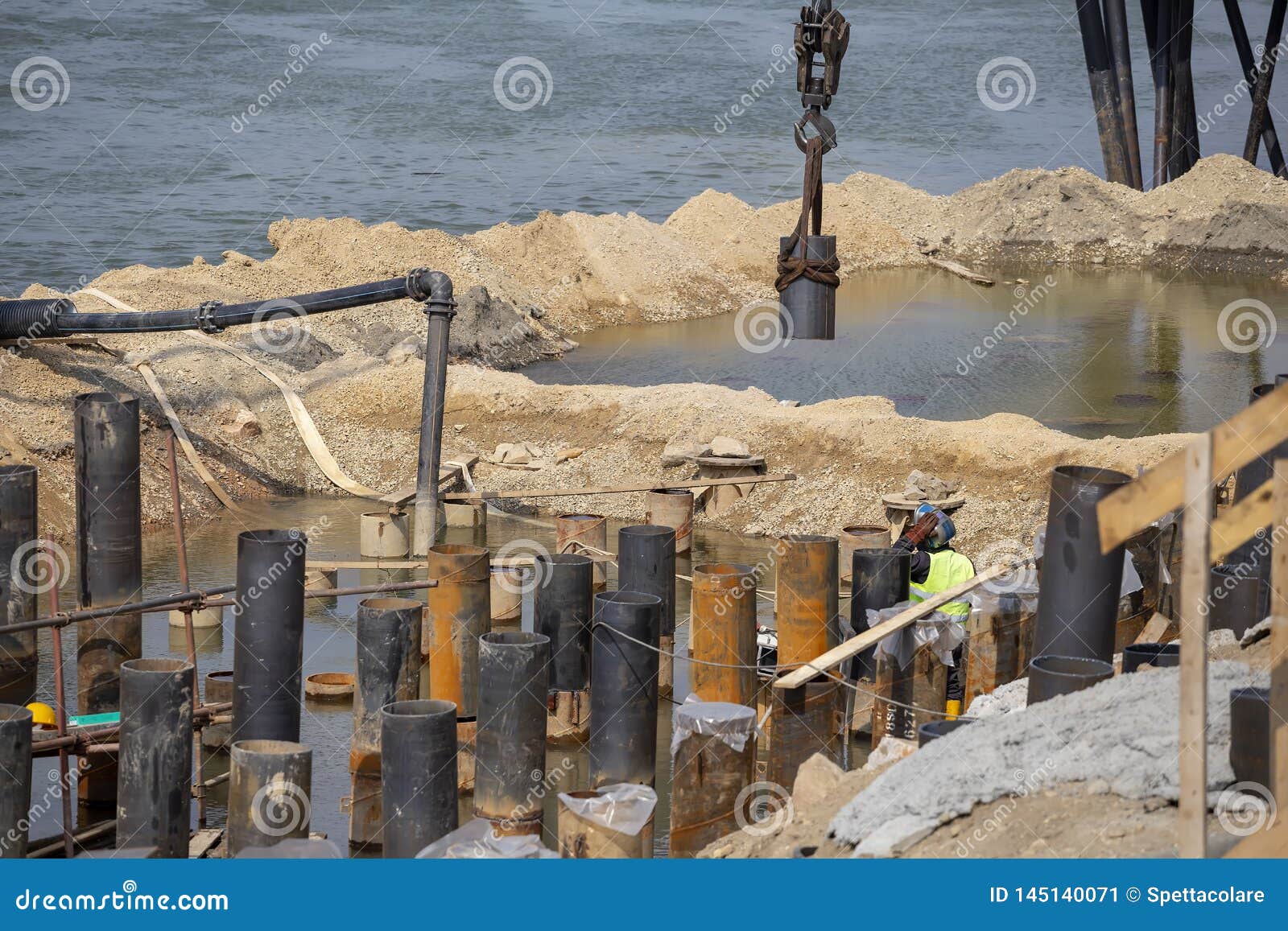 Row of Construction Poles on the River Bank 2 Stock Image - Image of ...