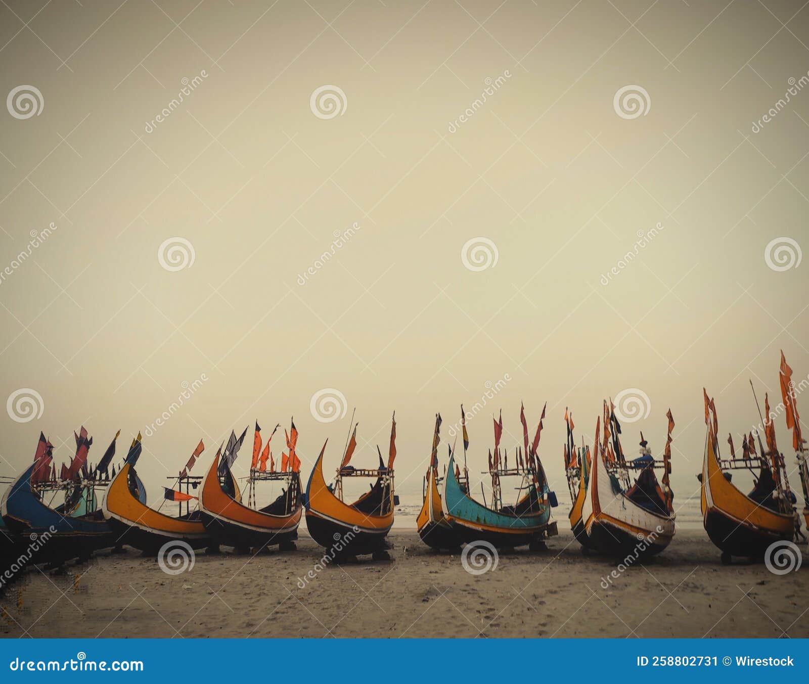 Row of Decorative Boats on a Misty Seashore Stock Image - Image of ...