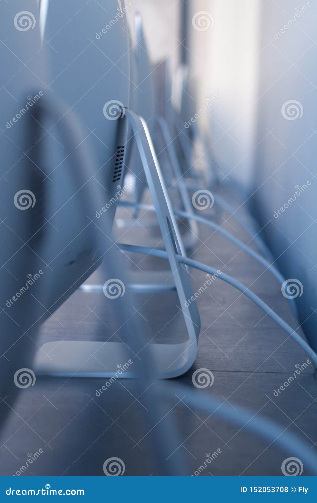 Row of Desktop Computers with Cables on Desk Stock Photo - Image of ...