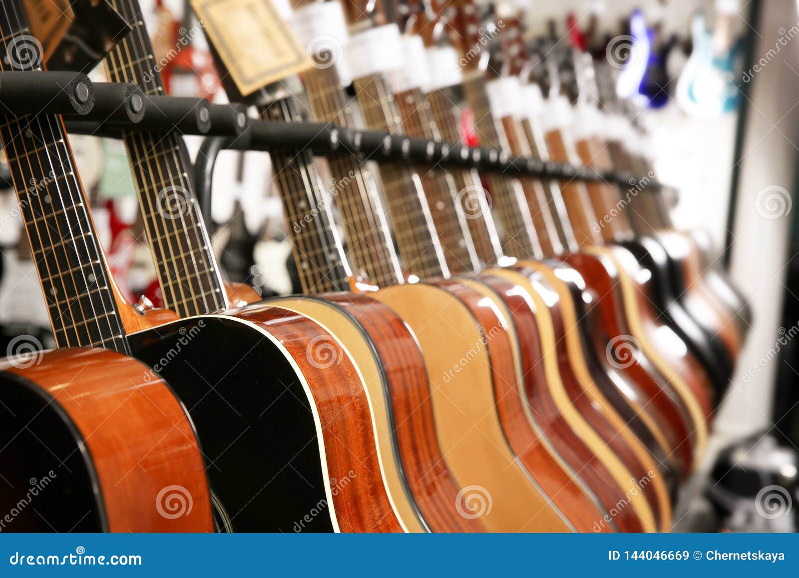 Row of Different Guitars in Music Store Stock Image - Image of ...