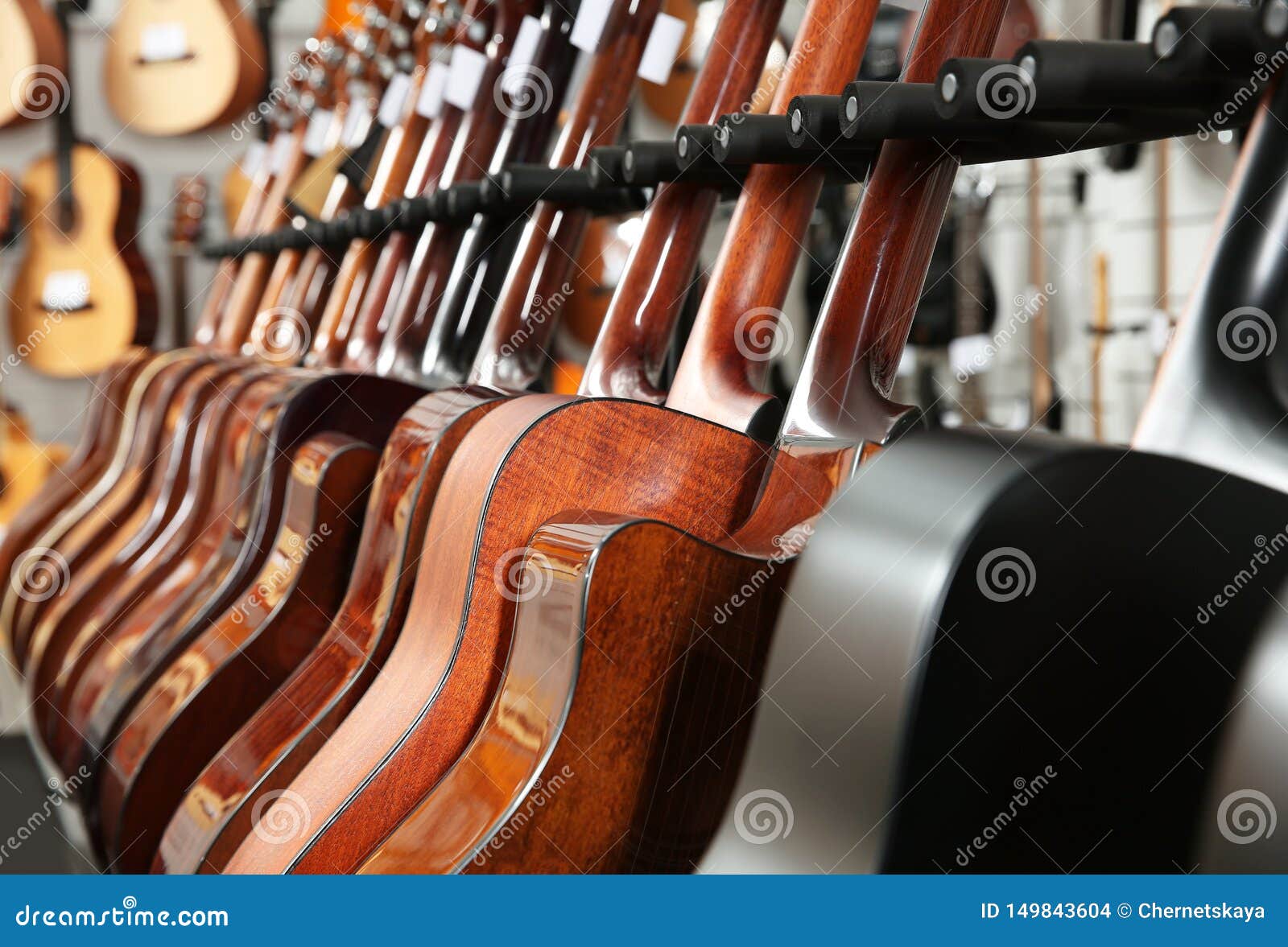 Row of Different Guitars in Music Store Stock Photo - Image of ...