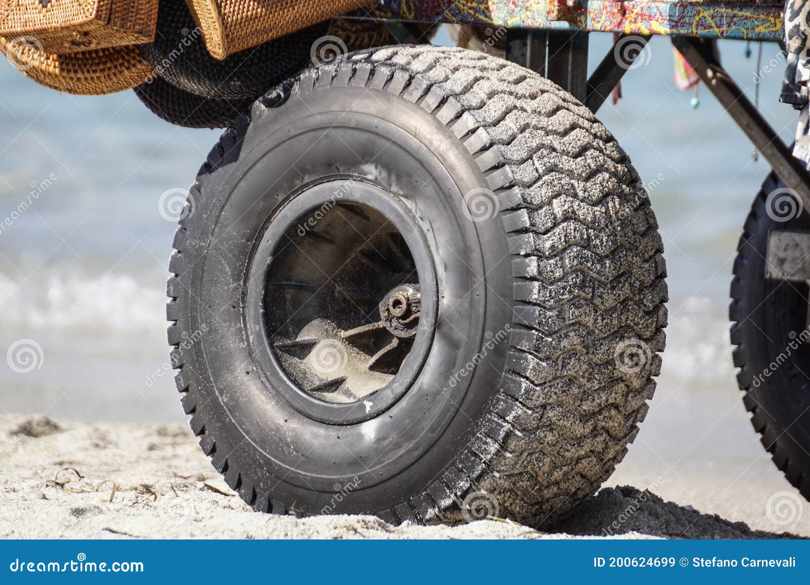 Row of Dinghy Sailing Wagon Wheels on Sand. Stock Image - Image of safe ...