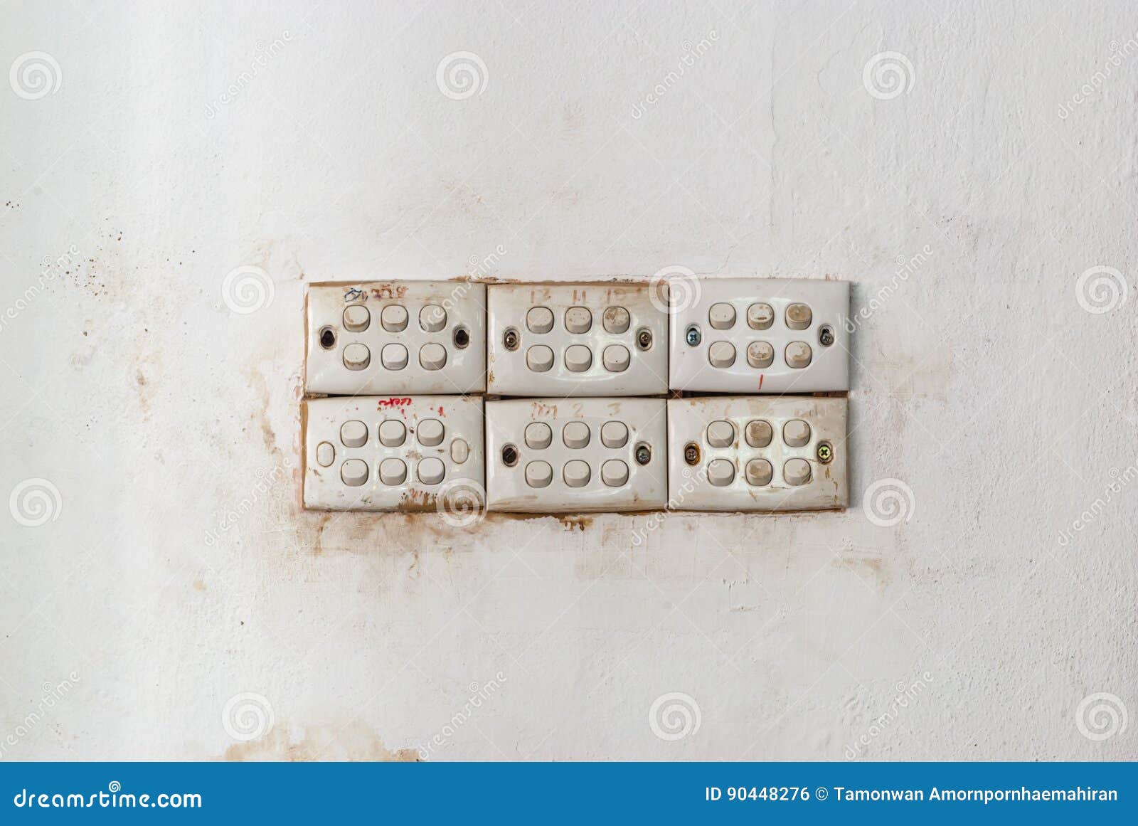 Row of Dirty Light Switches on Stained Concrete Wall Stock Photo ...