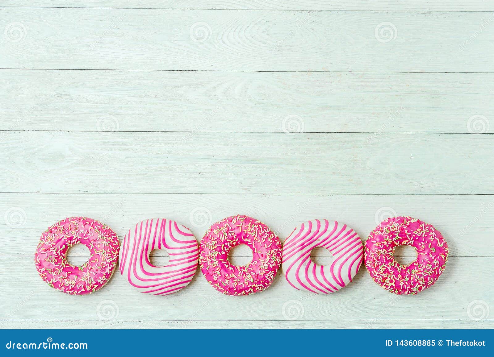 Row of Donut on White Wooden Table. Photo of Sweets with Copyspace. Top ...