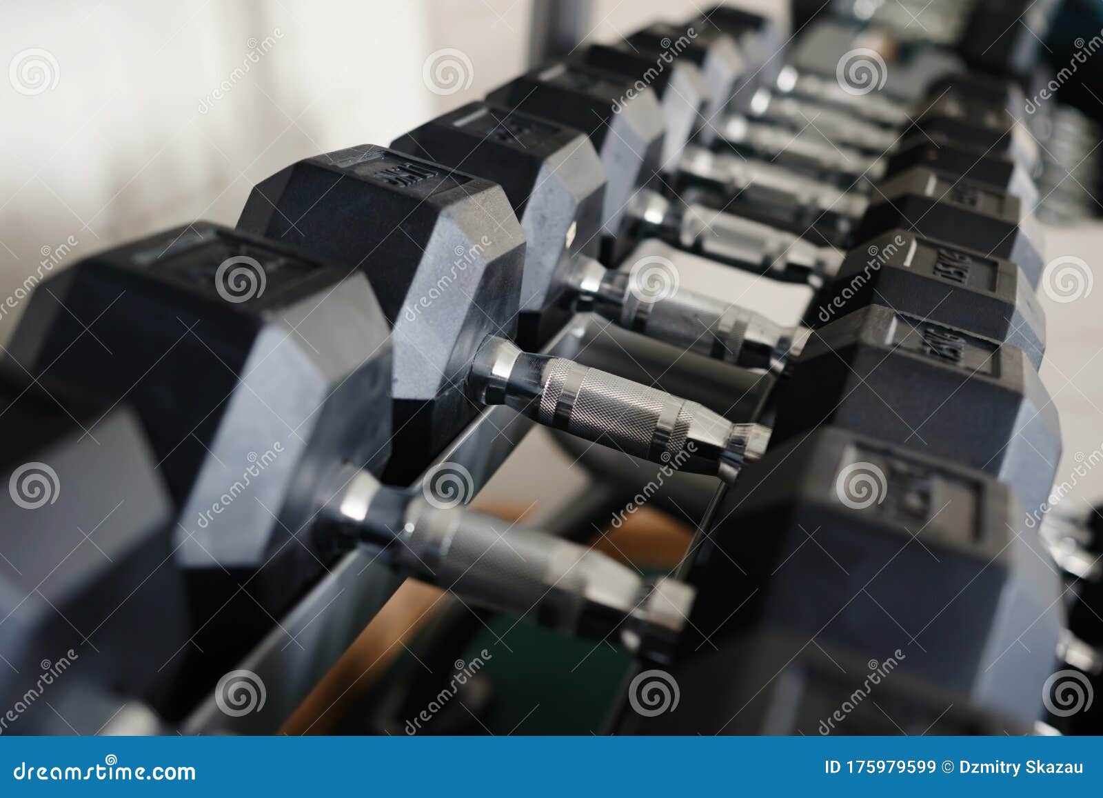 A row of dumbbells stock image. Image of bodybuilding - 175979599