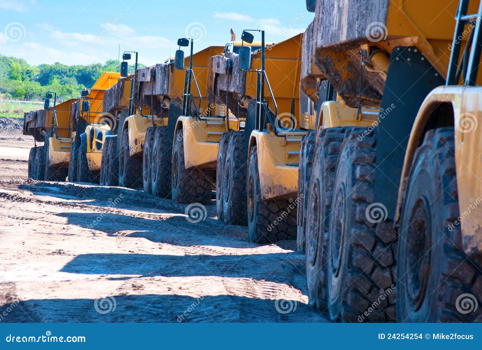 Dump Trucks Unloading Garbage Over Vast Landfill. Smoking Industrial ...