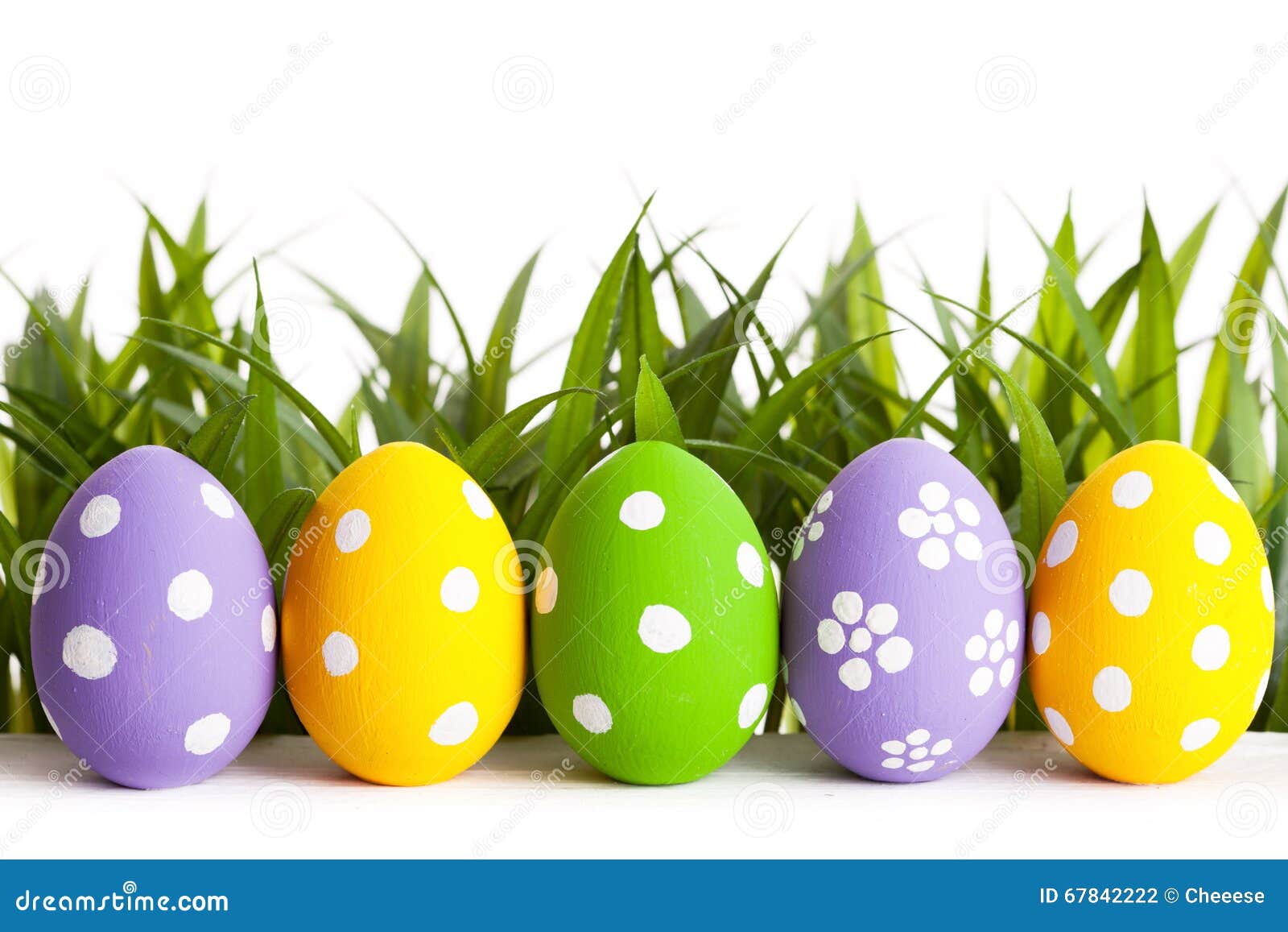Row of Easter Eggs on Grass Stock Photo - Image of easter, isolated ...