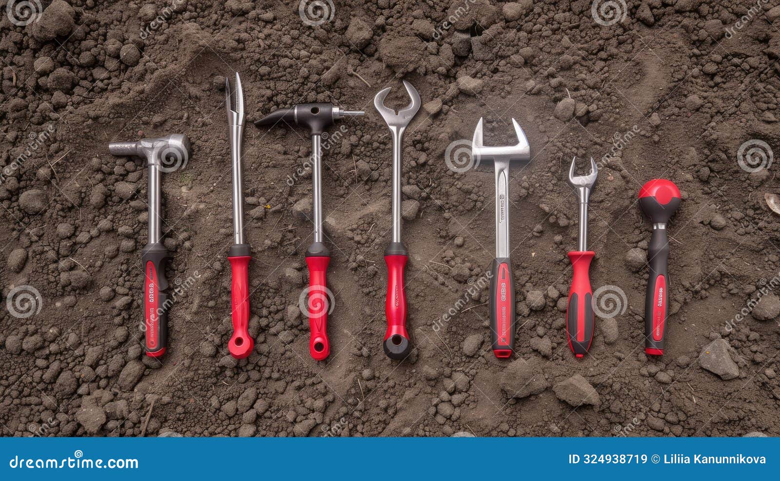 A Row of Eight Tools with Red Handles Lay on the Ground, Arranged from ...