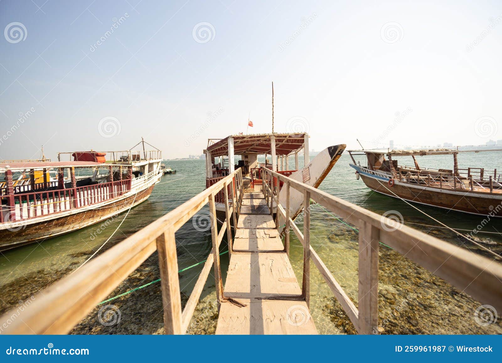 Row of Empty Old Traditional Dhow Ships Docked by the Shore at Doha ...