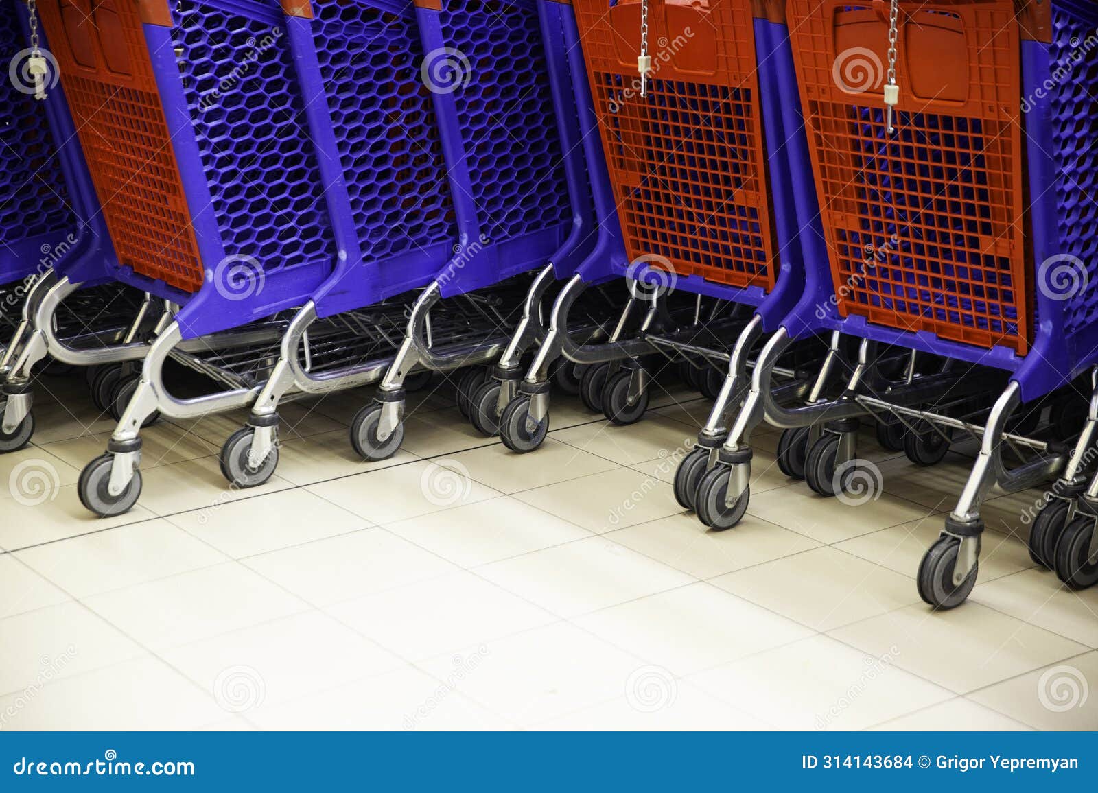 Row of Empty Shopping Carts in the Big Supermarket Stock Photo - Image ...