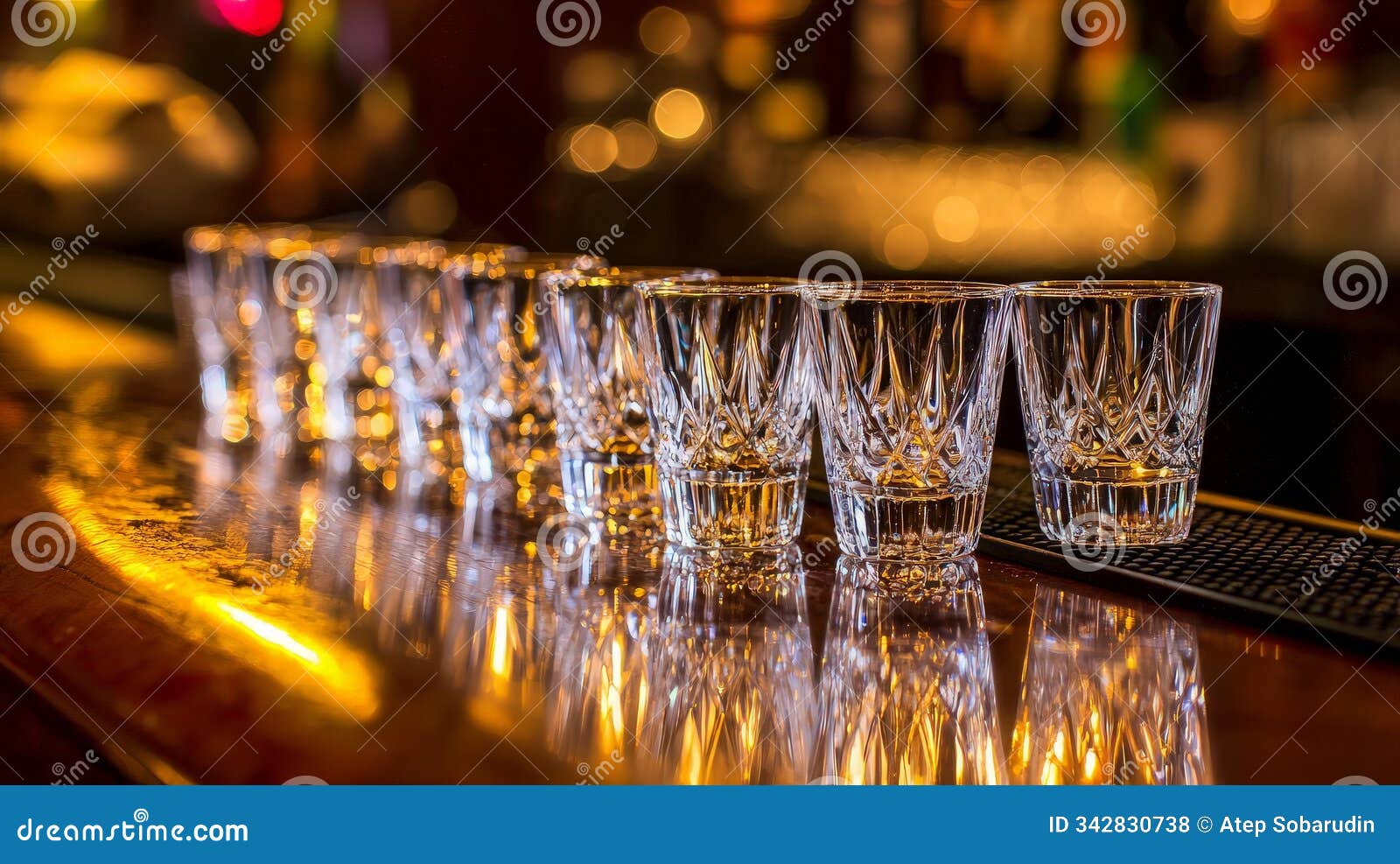 A Row of Empty Shot Glasses on a Bar Counter, Ready for Drinks Stock ...