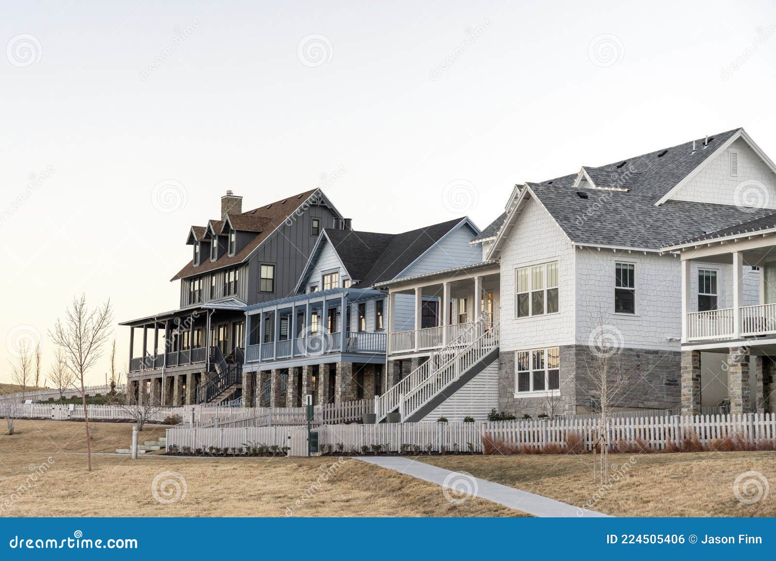 Row of Fenced Residential Buildings with Different Architectural ...