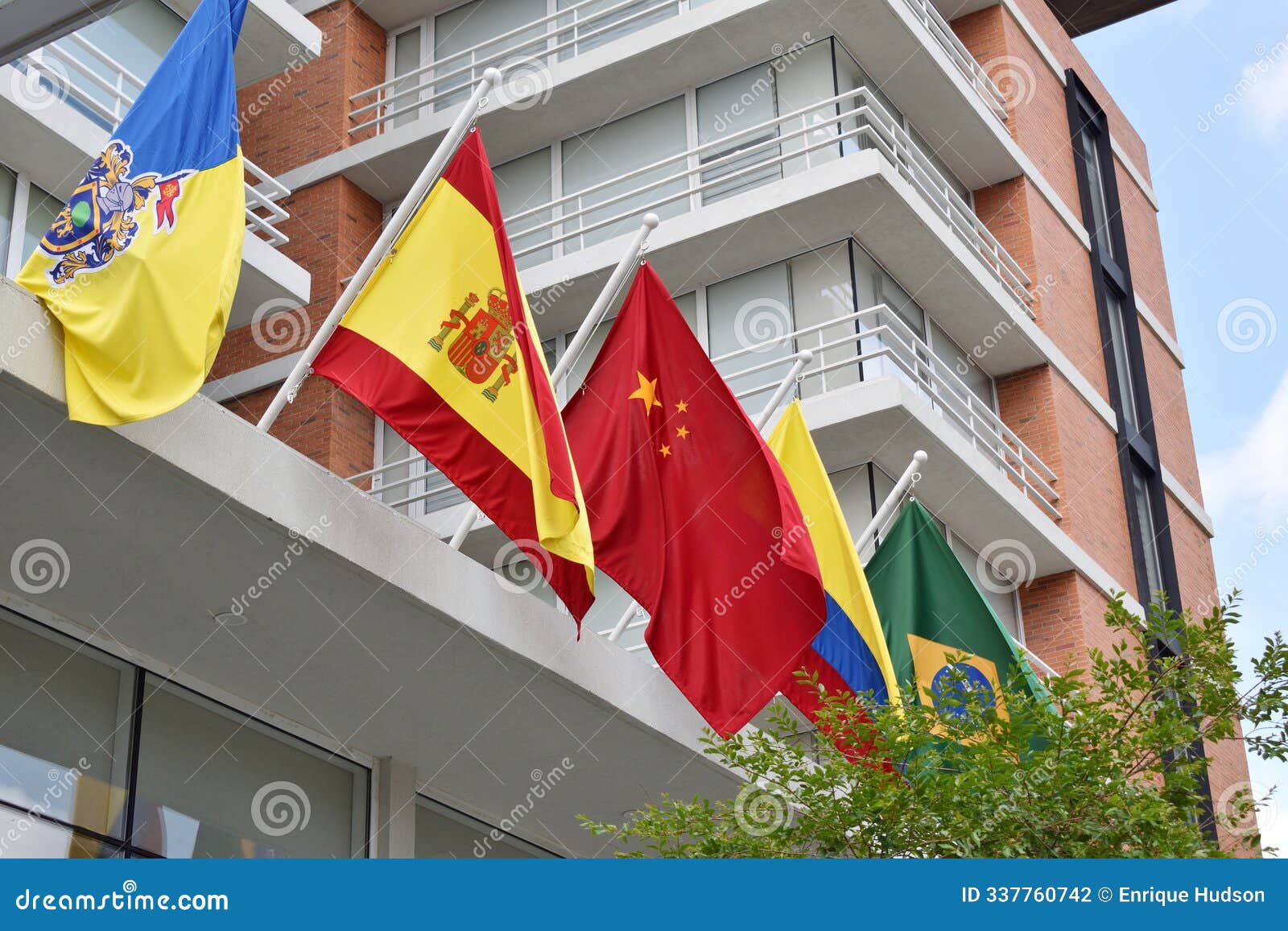 A Row of Flags from Different Countries are Hanging from the Side of a ...