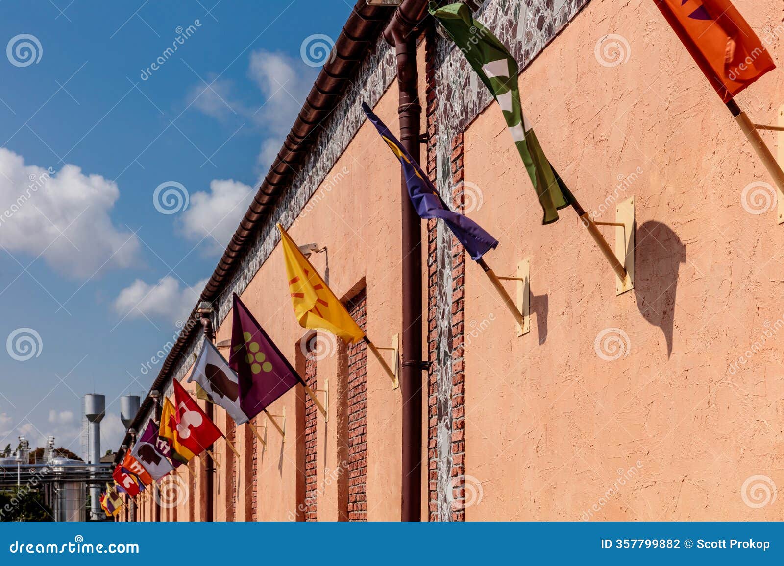 A Row of Flags Hanging from a Building Stock Photo - Image of house ...