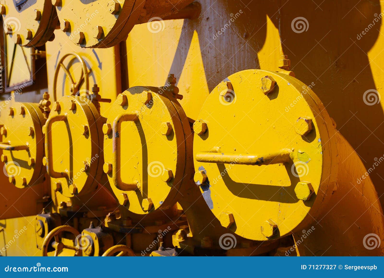 Row of flanged pipe plugs stock image. Image of pipe - 71277327