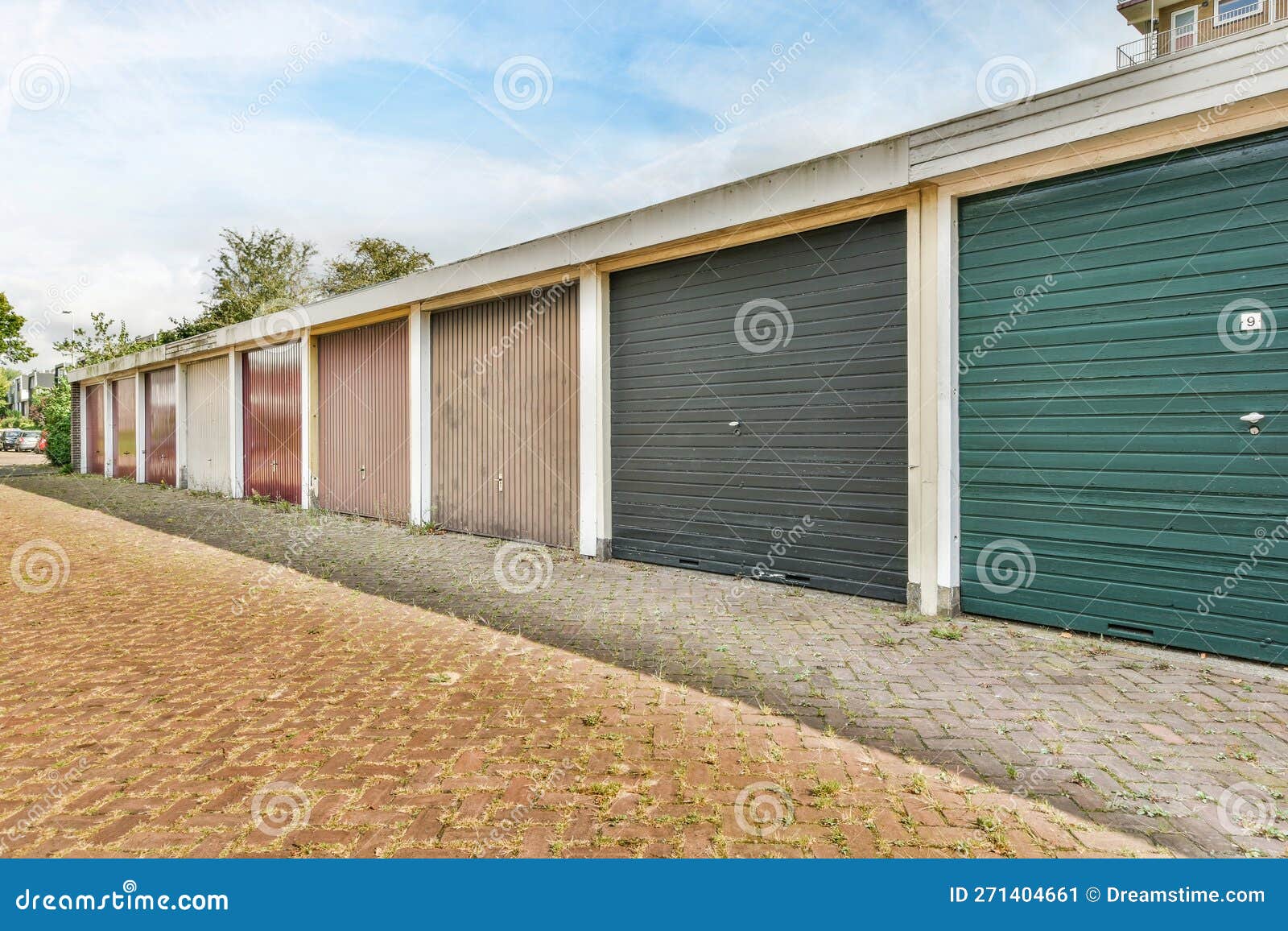 A Row of Garages with Green Roll Up Doors Editorial Photo - Image of ...