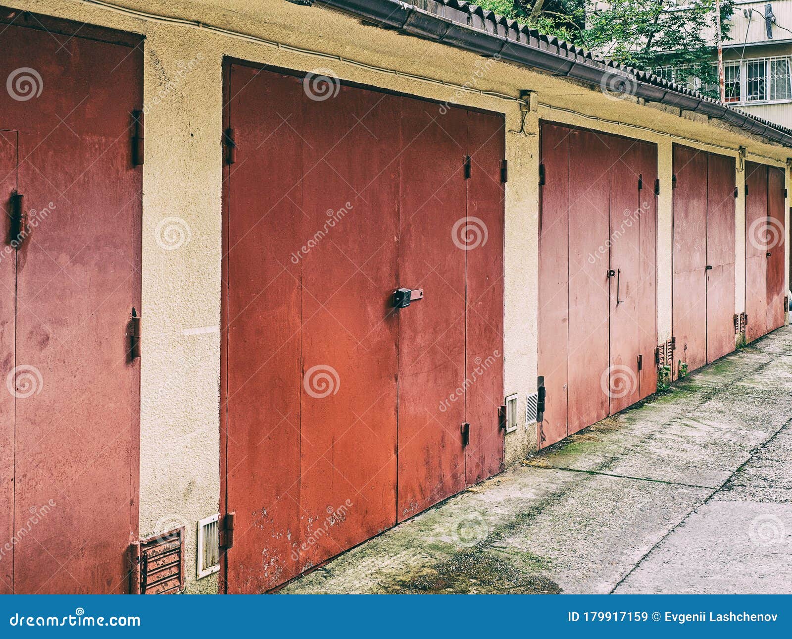 A Row of Garages with Red Gates Stock Image - Image of horizontal, port ...