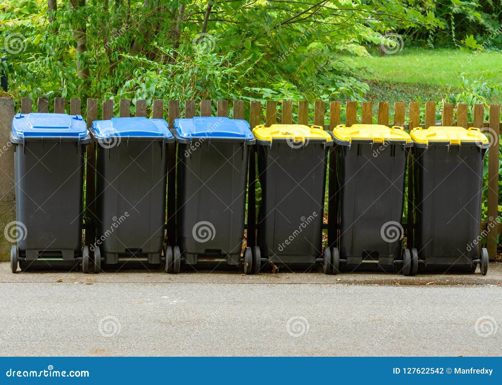 Row of garbage cans stock photo. Image of recycling - 127622542