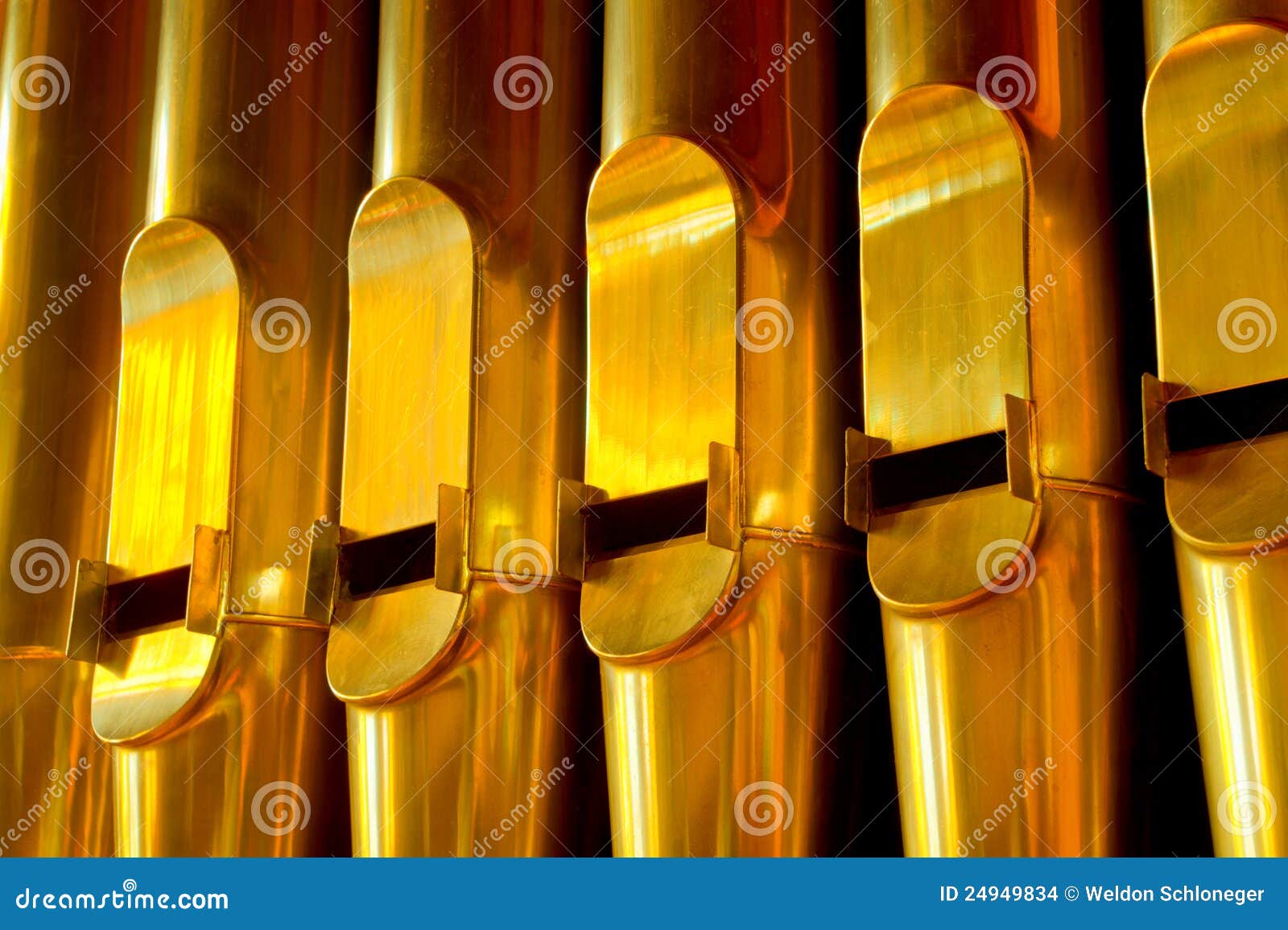 Row of gold organ pipes stock photo. Image of pattern - 24949834