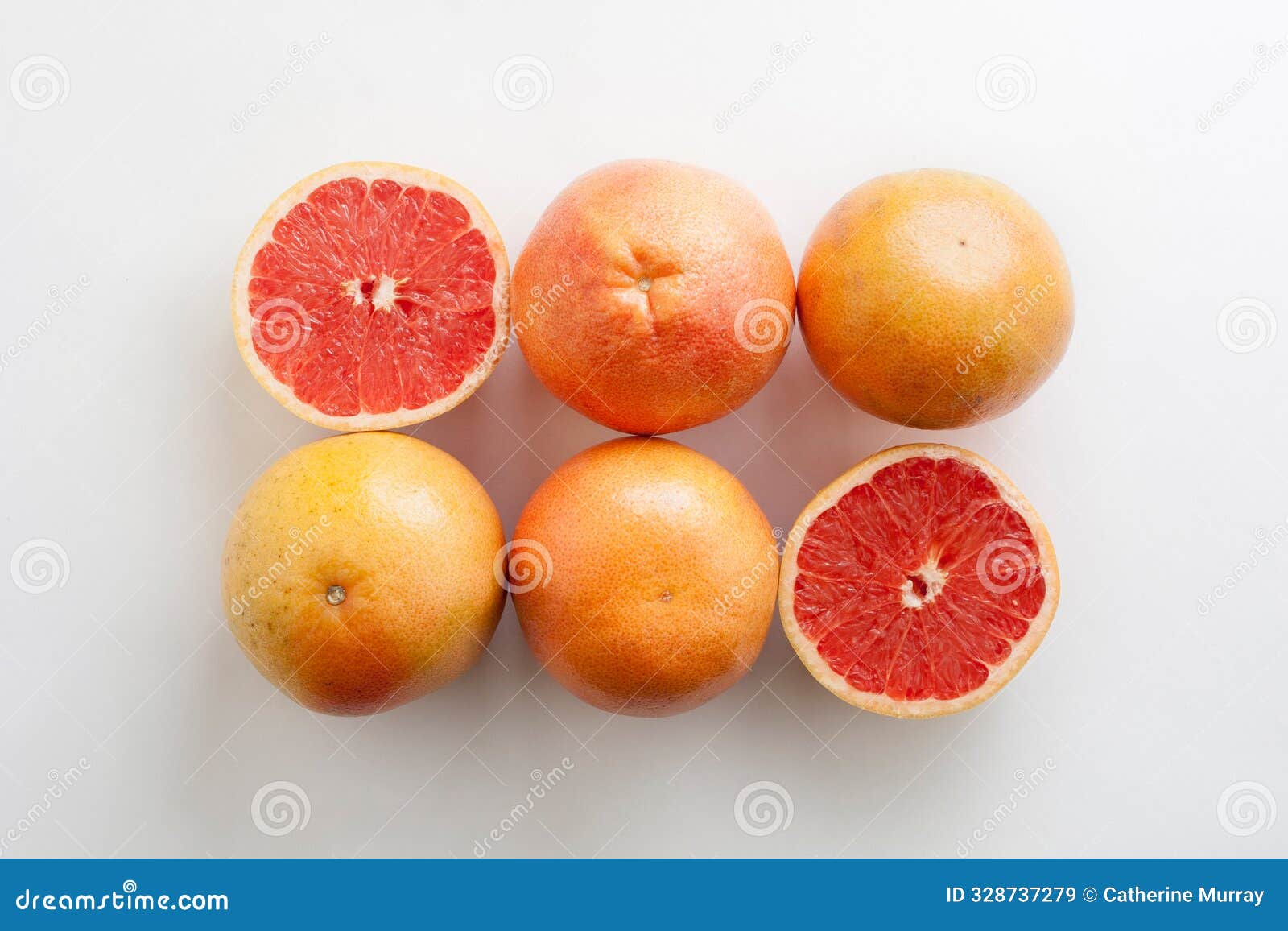 A Row of Grapefruits on White Background Stock Image - Image of serving ...