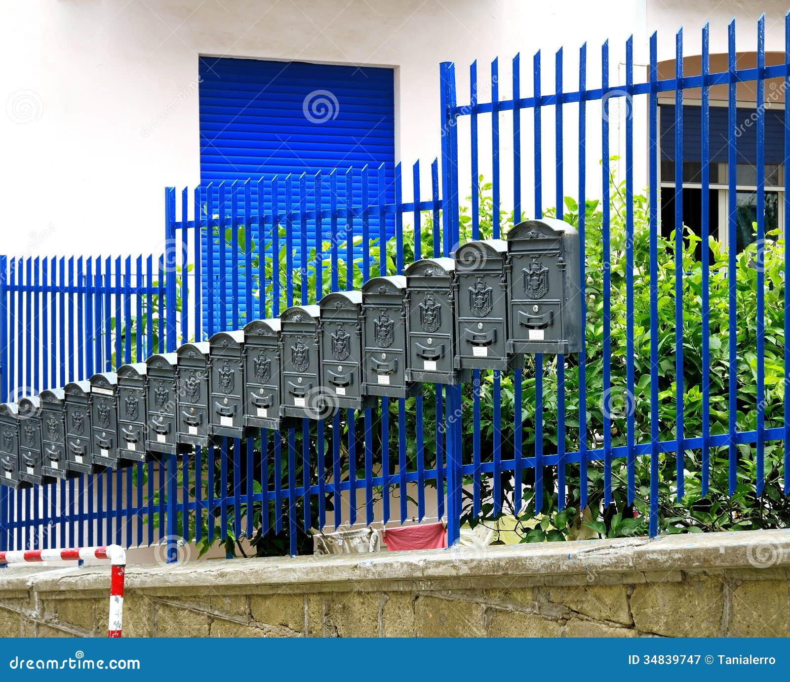 Row of Gray Metal Mailboxes Near Railing Stock Image - Image of group ...