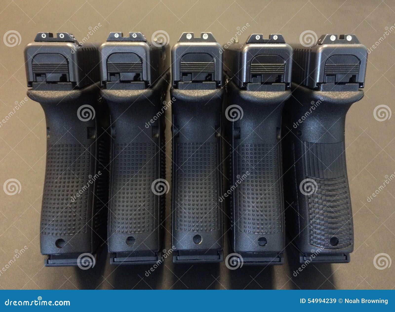 Row of Guns stock image. Image of sidearm, black, firearm - 54994239