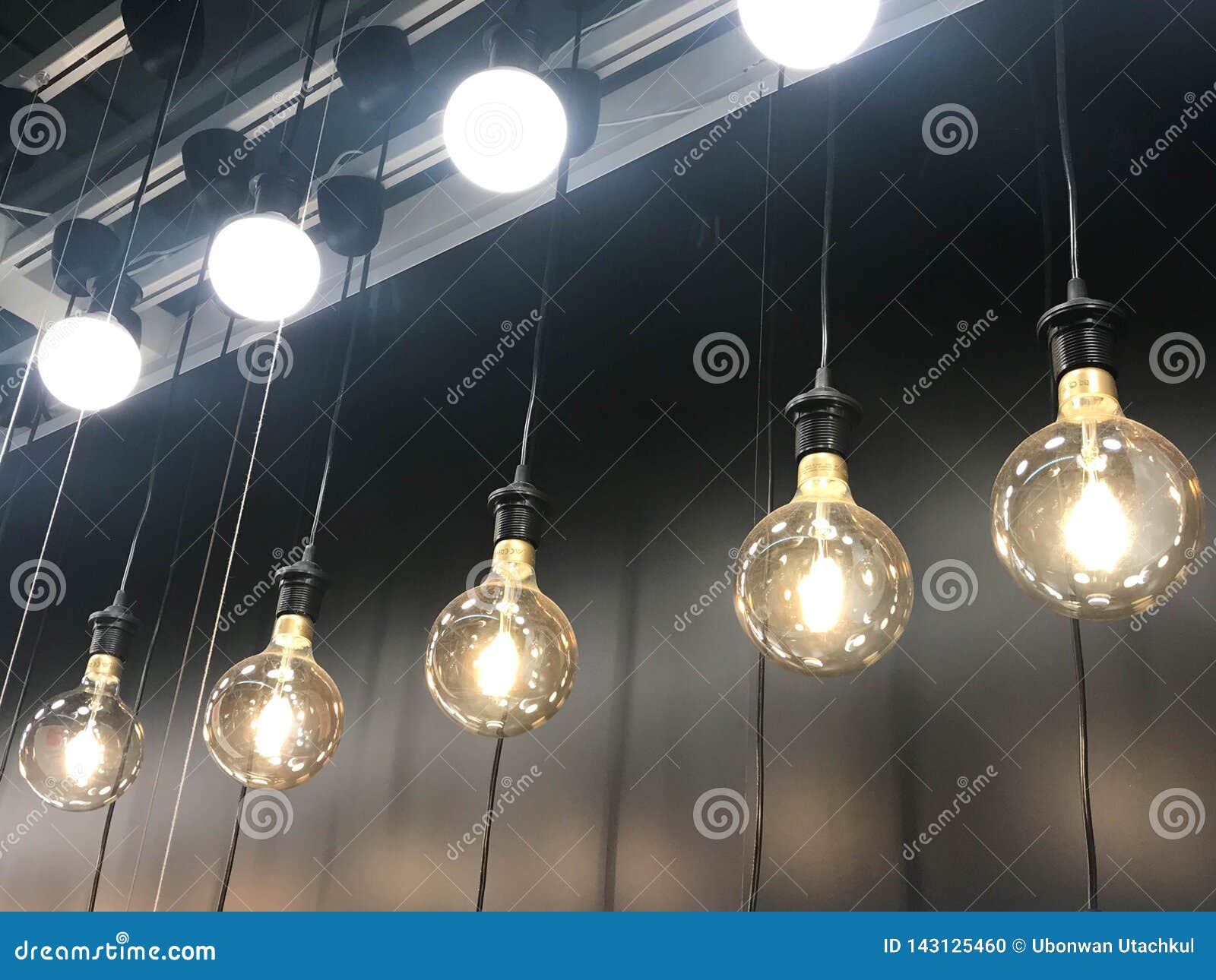 Row of Hanging Lamp and Light Bulb Stock Photo - Image of electric ...