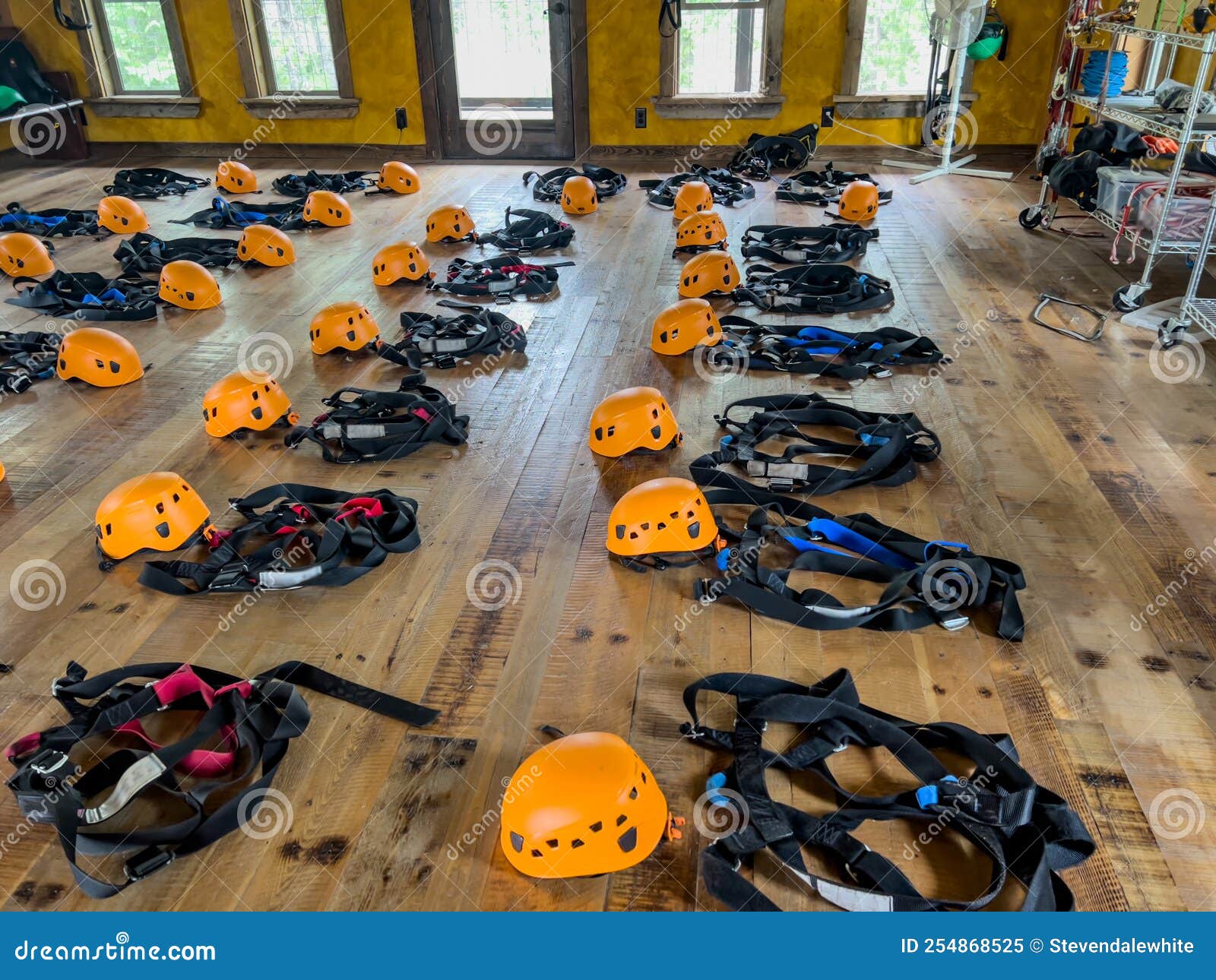 Row of Helmets and Harnesses Ready for Use at a High Ropes and Climbing ...