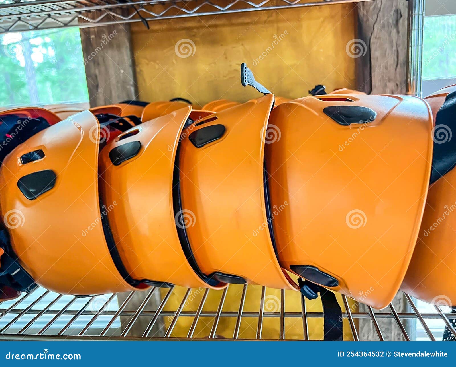 Row of Helmets Ready for Use at a High Ropes and Climbing Course. Stock ...