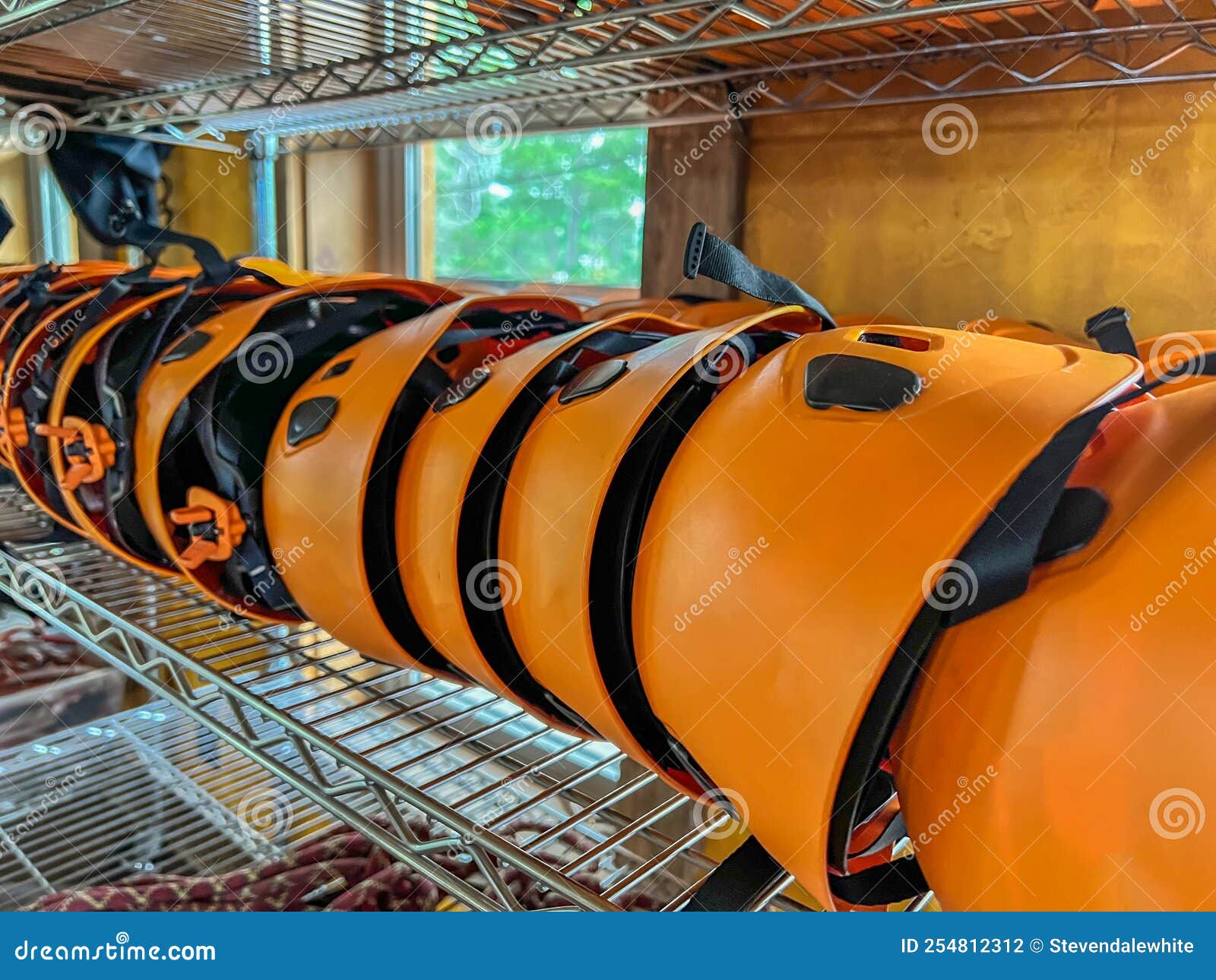 Row of Helmets Ready for Use at a High Ropes and Climbing Course. Stock ...