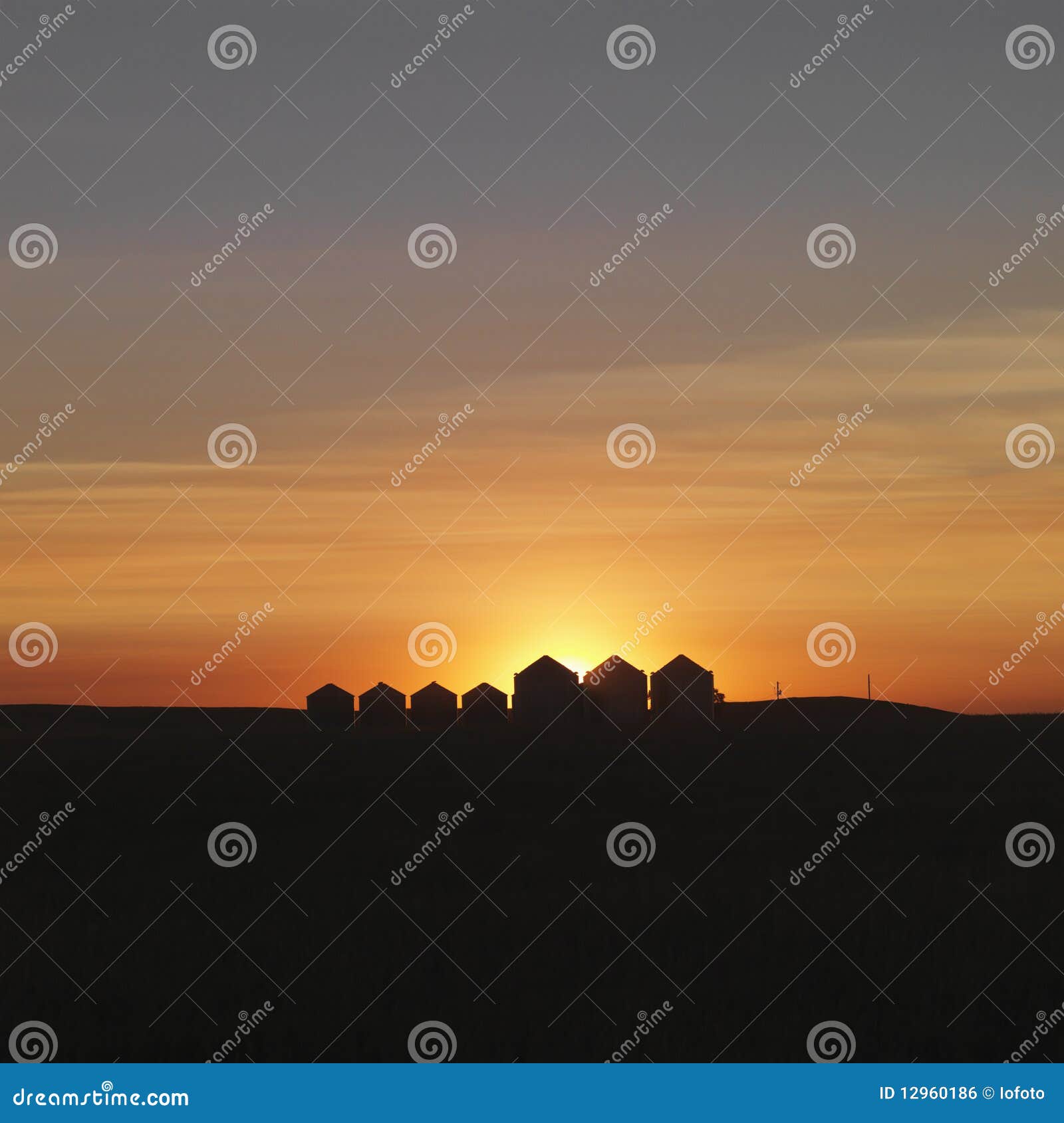 Row of Houses Silhouetted at Sunset Stock Photo - Image of background ...