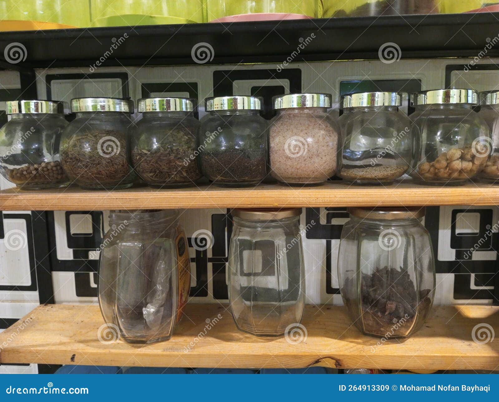 A Row of Jars Filled with Spices Neatly Arranged on a Kitchen Shelf ...