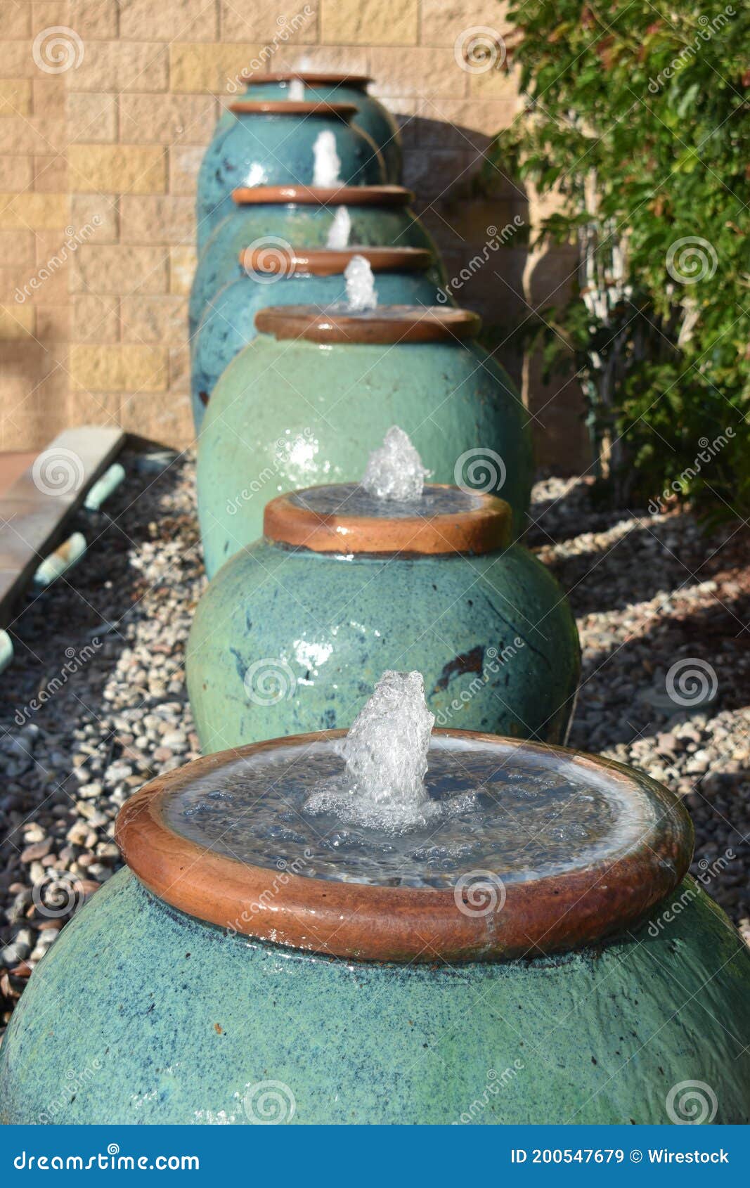 Row of Jug-shaped Fountains in the Garden Stock Image - Image of design ...